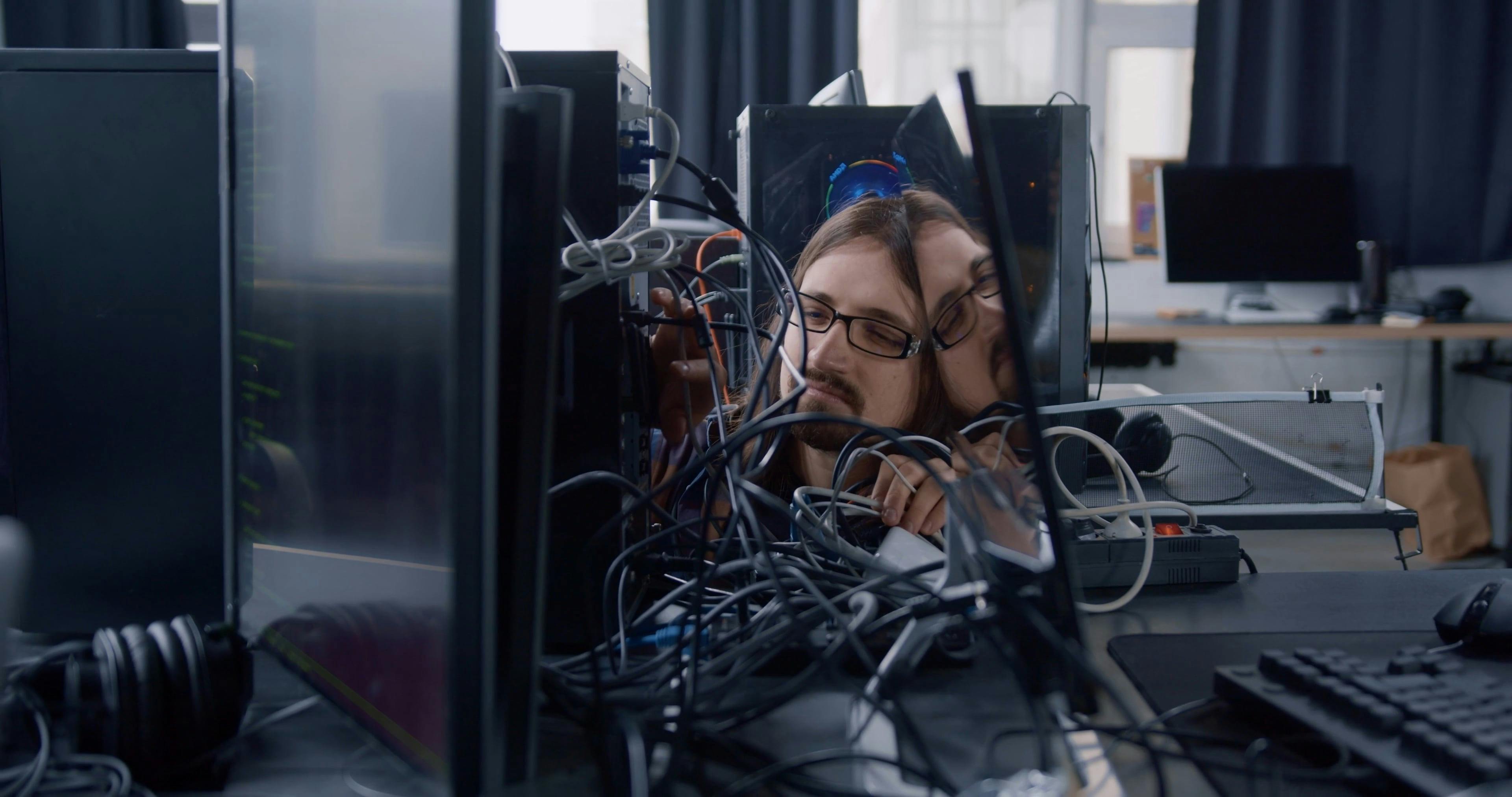 Man Checking the Computer Cables · Free Stock Video