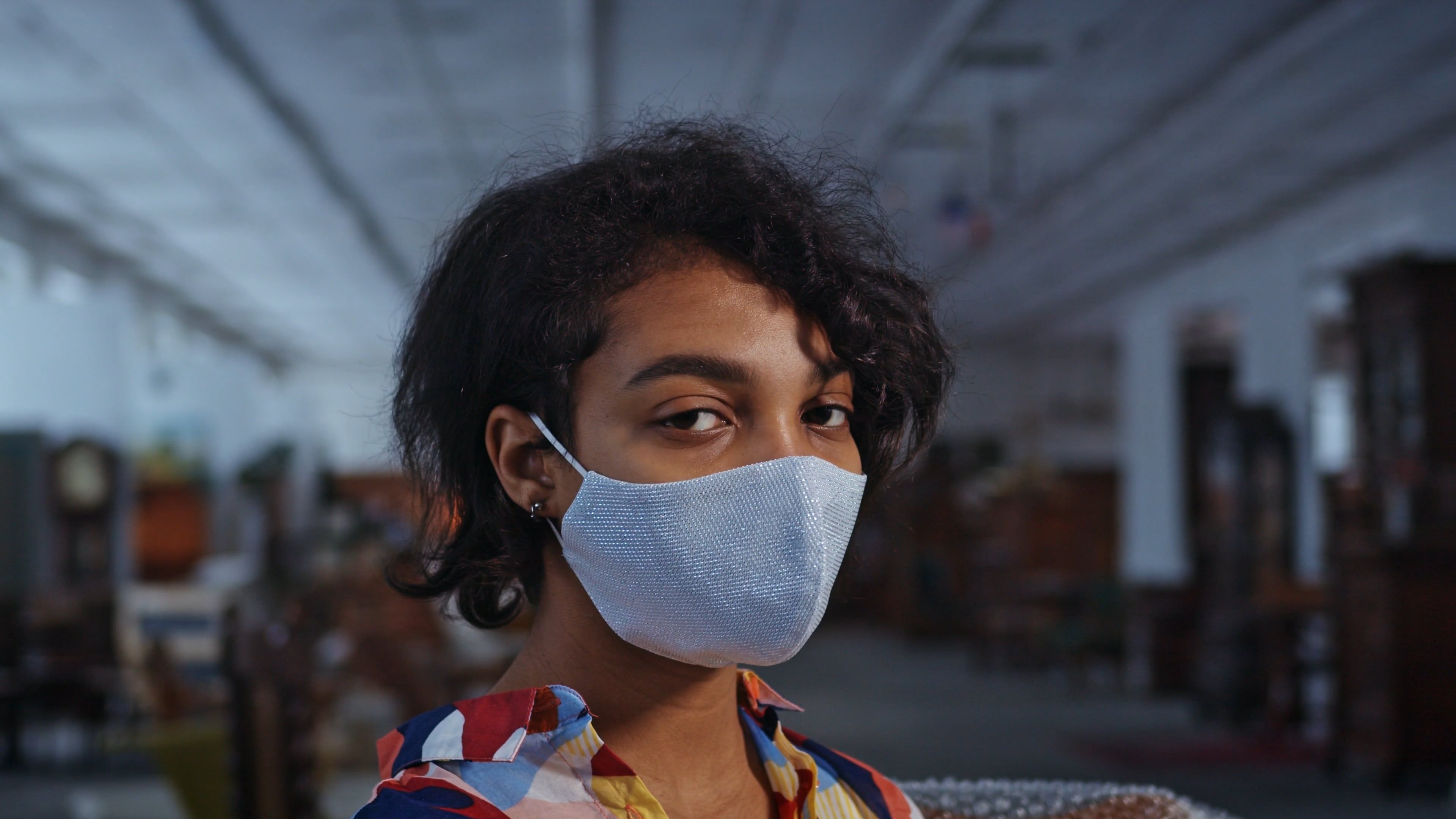A Woman Wearing a Blue Face Mask and Looking at the Camera · Free Stock ...