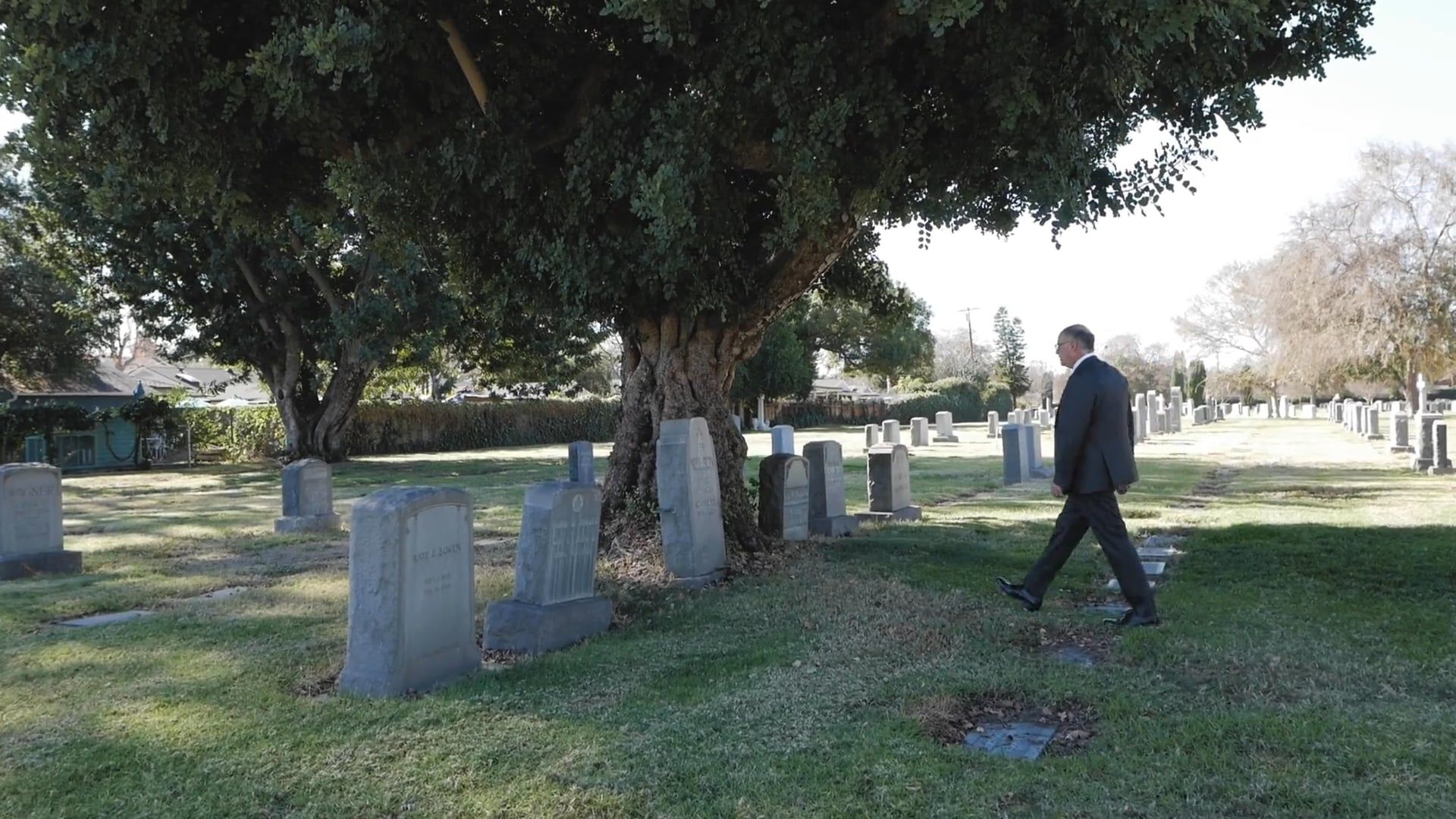 A Man Walking towards a Gravestone and Laments · Free Stock Video