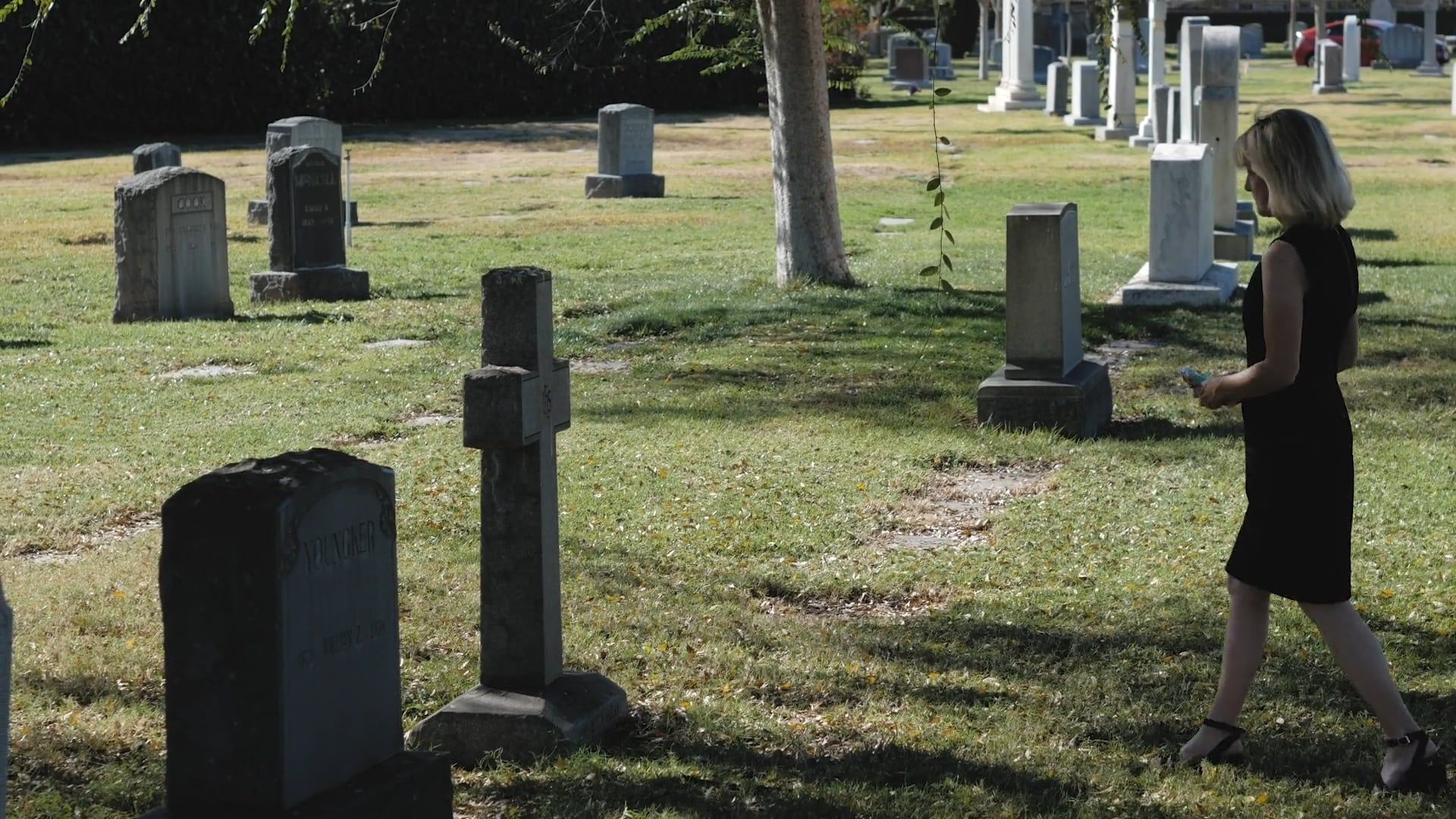 A Woman Praying in Front of a Tombstone · Free Stock Video