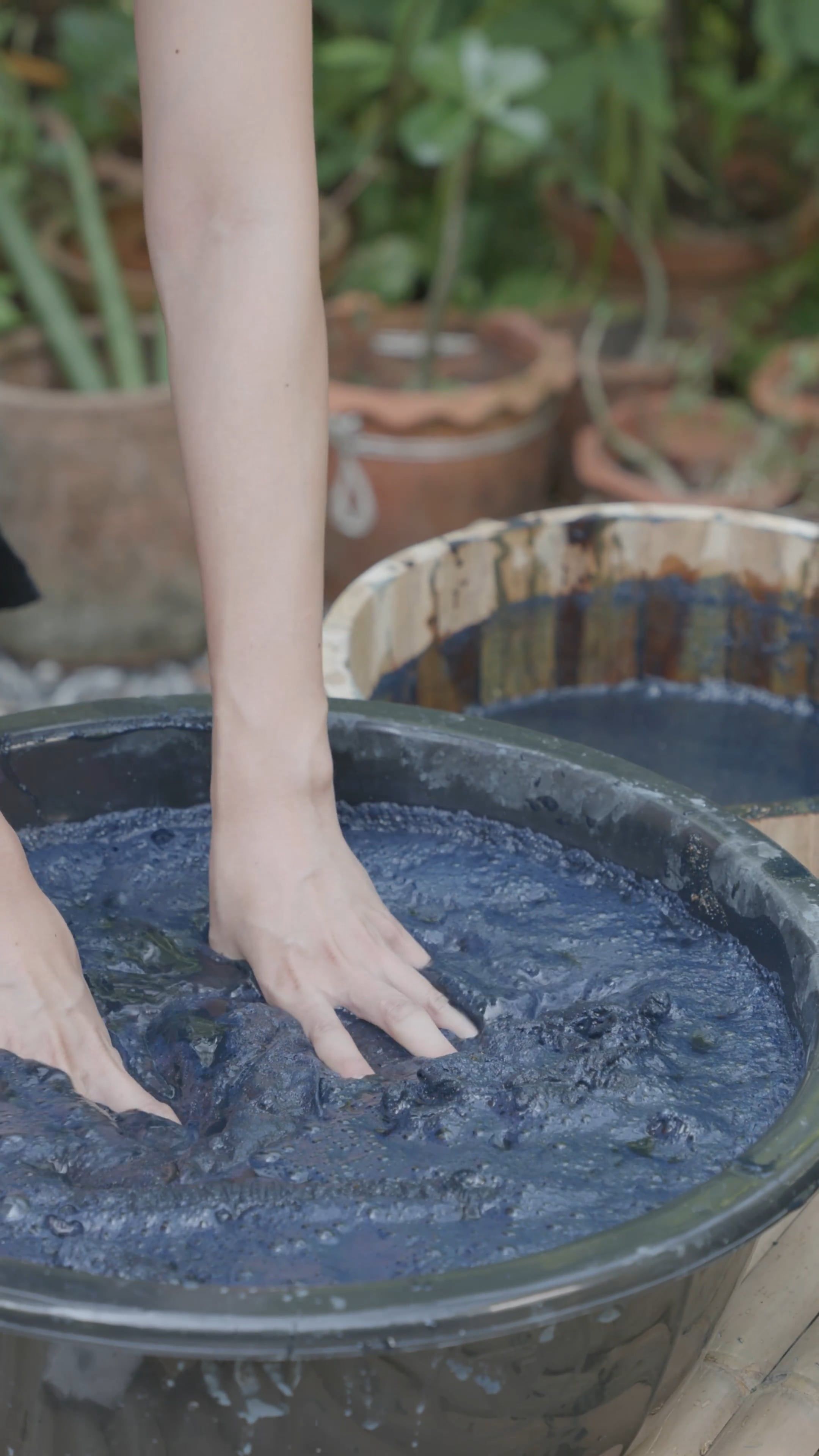 A Person Soaking Fabrics into a Dye Bath Free Stock Video Footage ...
