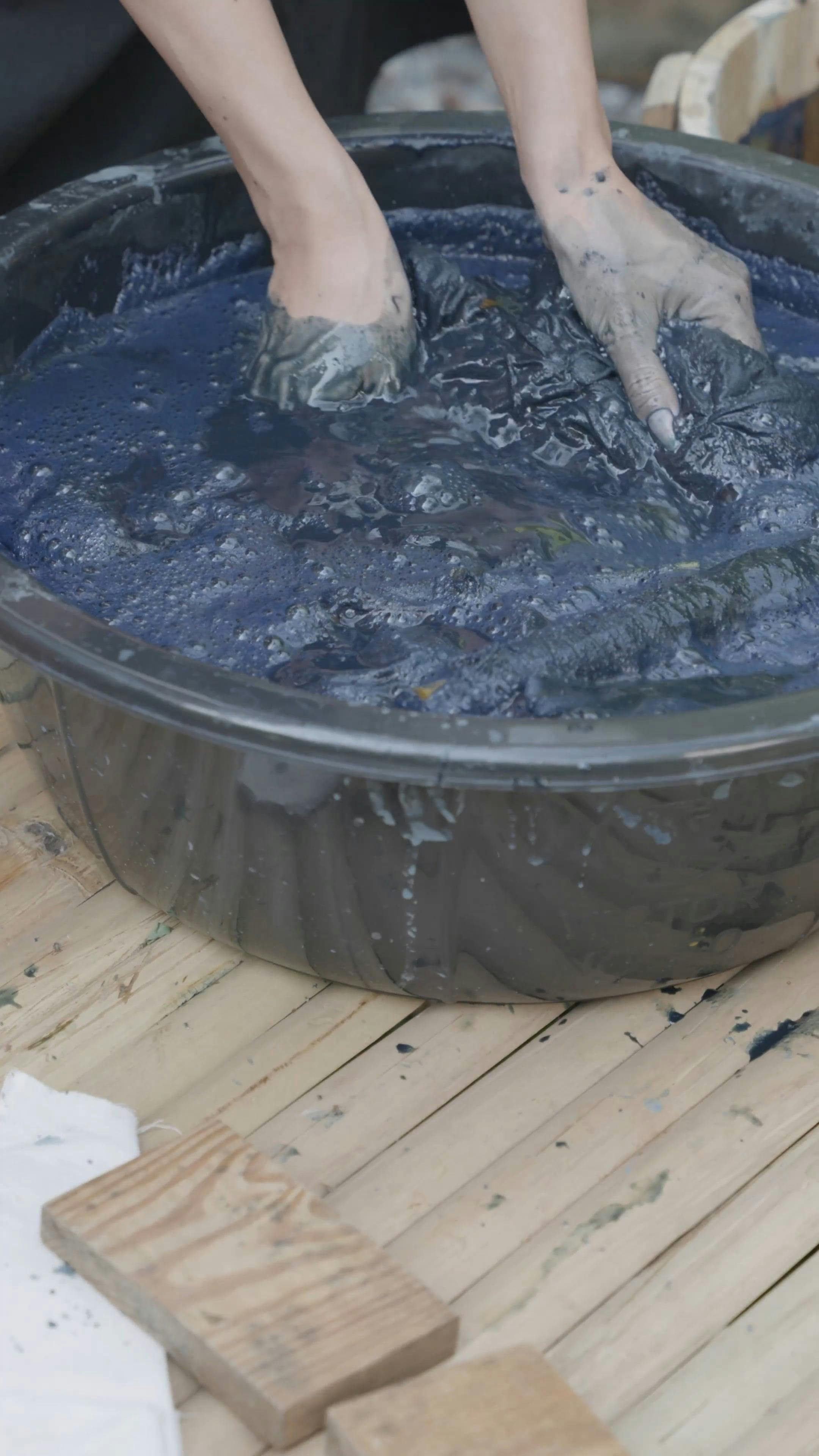 A Person Soaking Fabrics into a Dye Bath Free Stock Video Footage ...