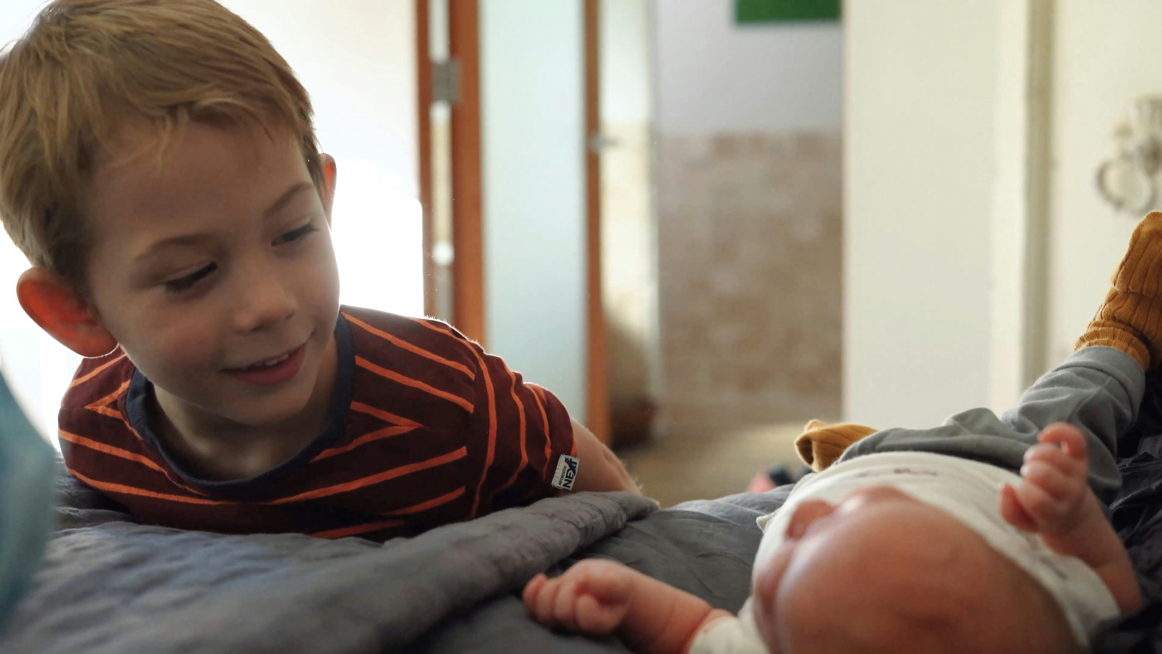 Boy Playing with the Baby · Free Stock Video