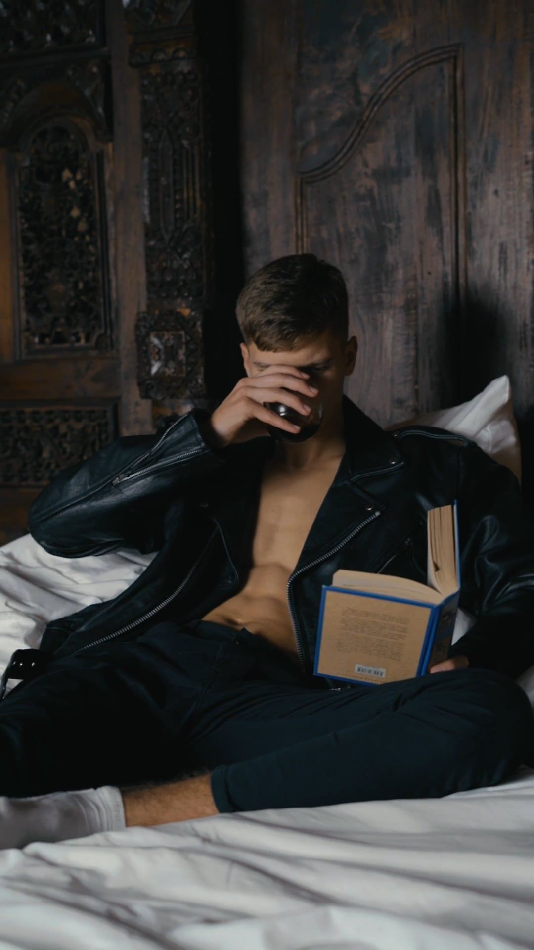 Man Sitting on His Bed while Reading a Book · Free Stock Video