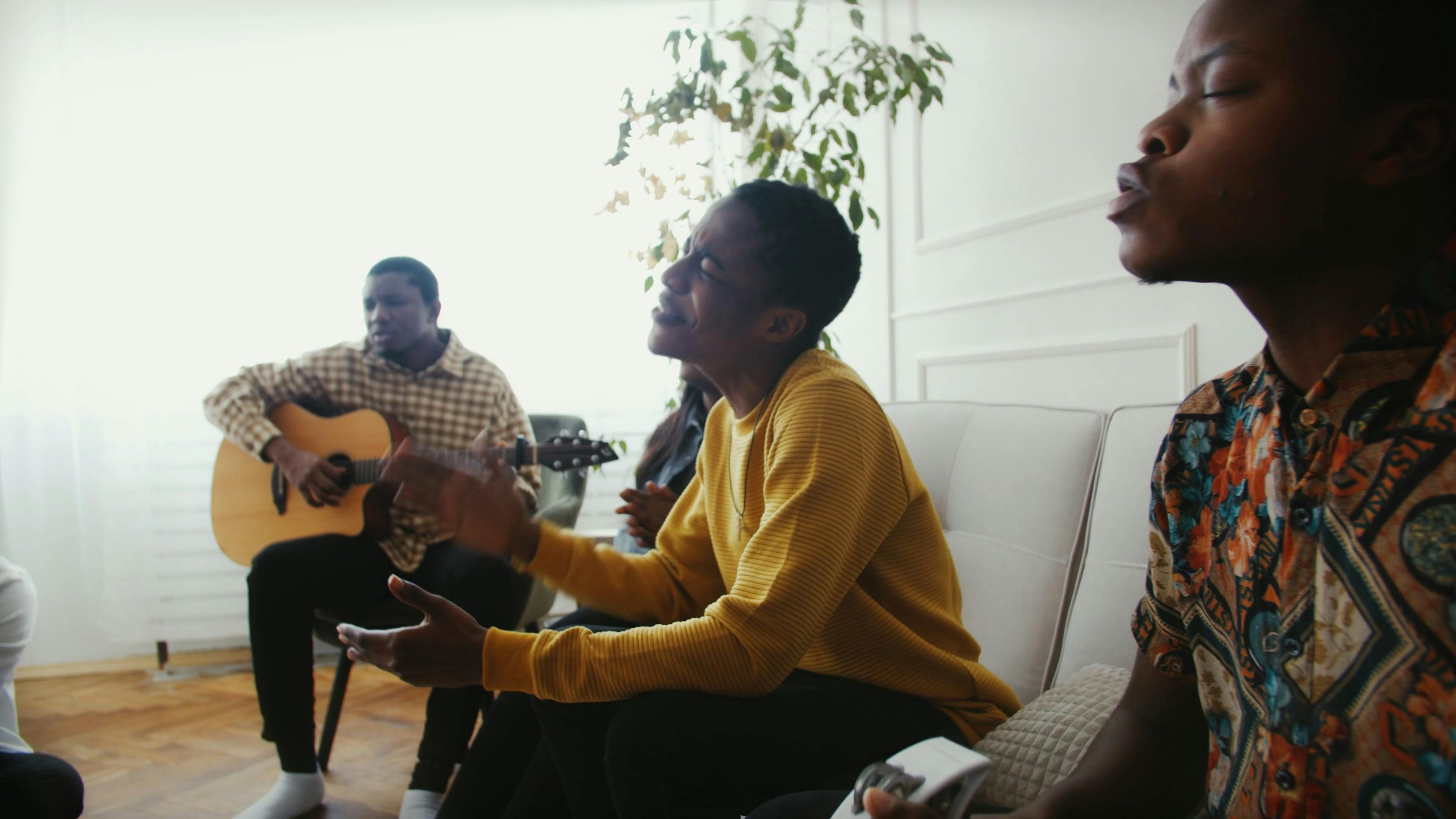 Christians Singing a Song And Playing Musical Instruments · Free Stock ...