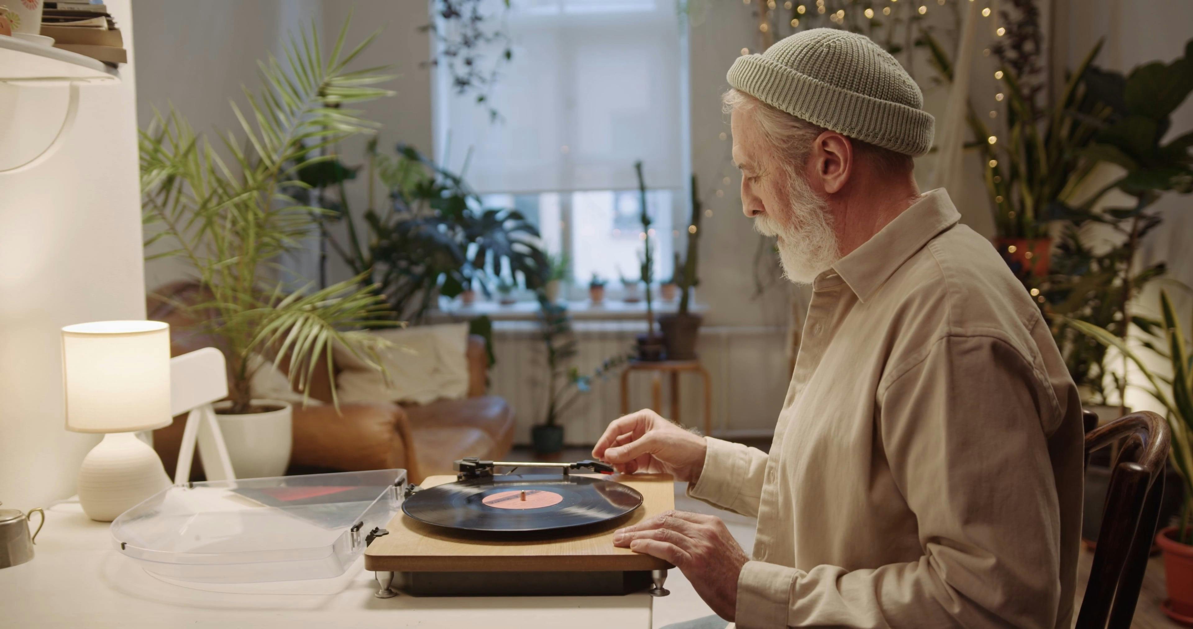 Elderly Man Listening to Vinyl Record · Free Stock Video
