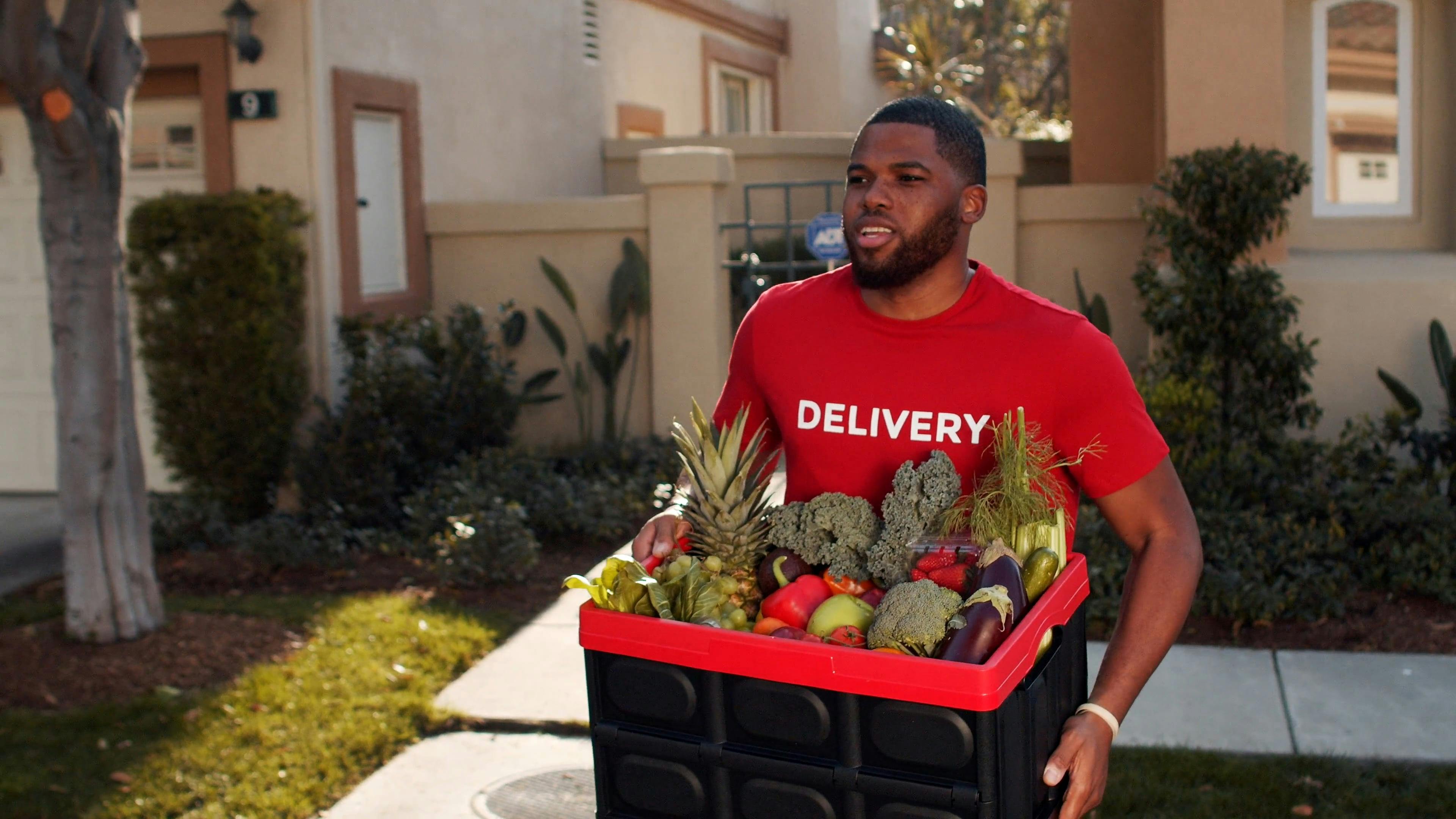 A Man Delivering a Crate of Fruits and Vegetables · Free Stock Video