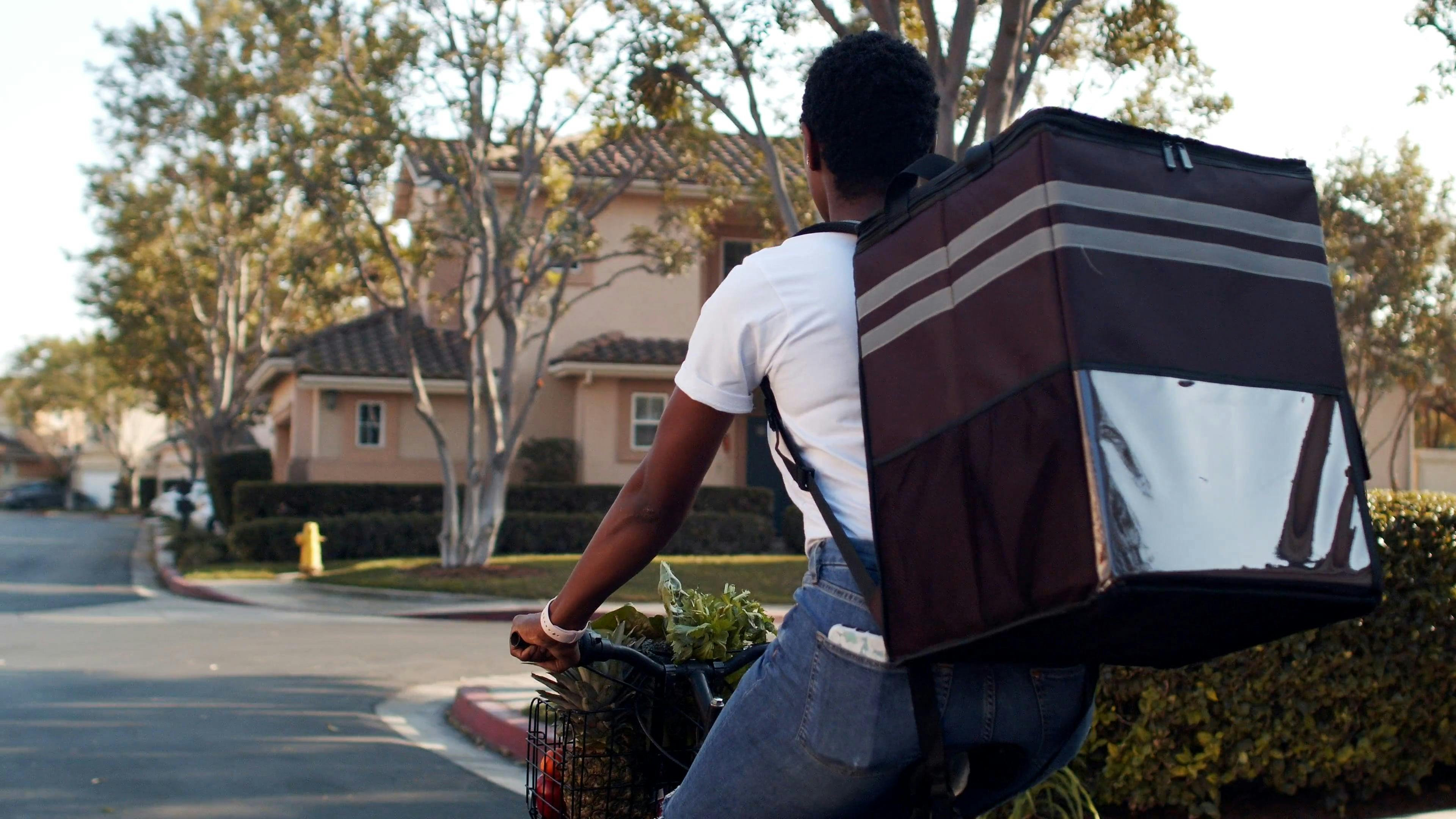 A Delivery Man Riding a Bike · Free Stock Video