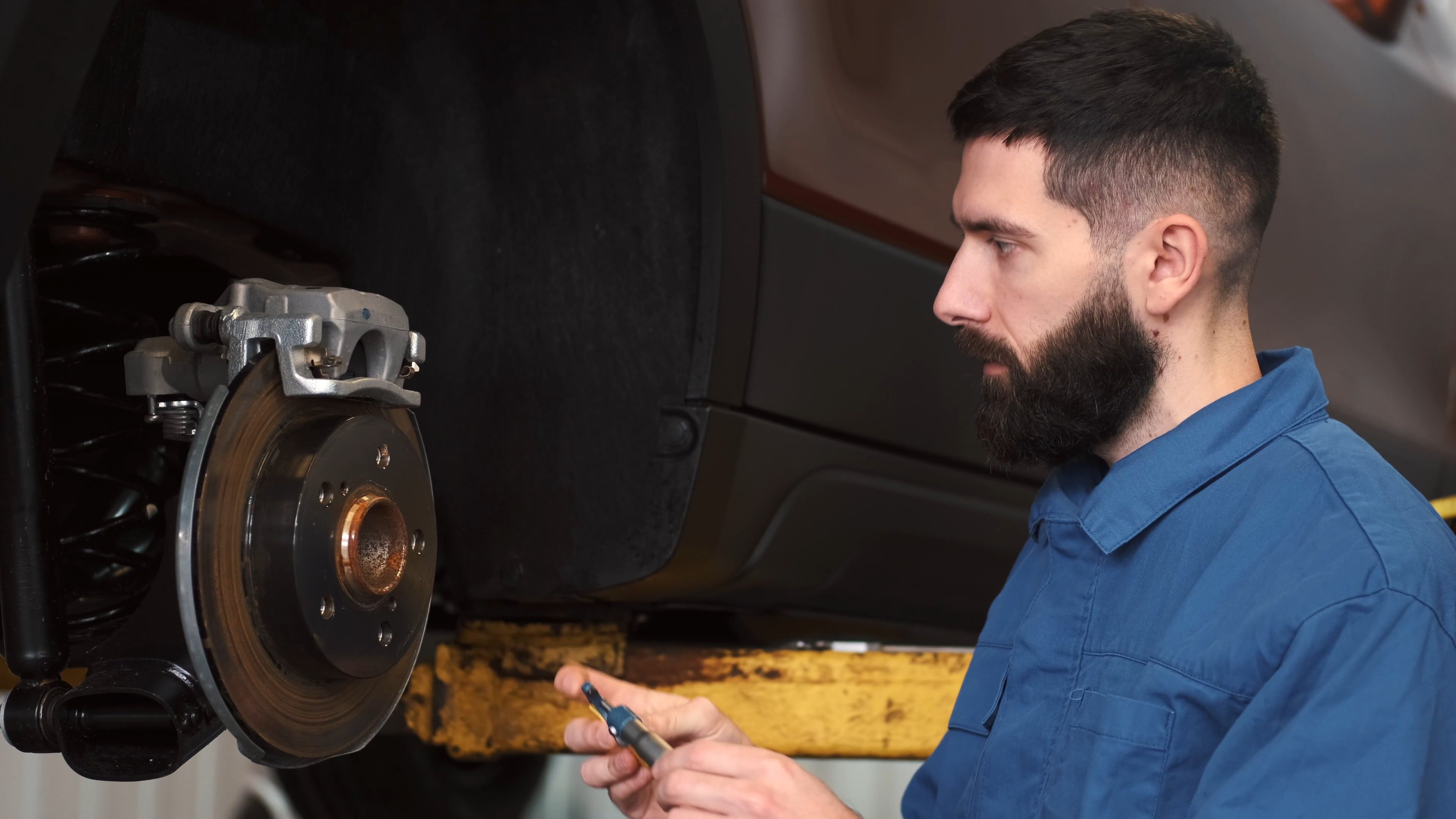 A Mechanic Repairing a Car Wheel Free Stock Video Footage, Royalty-Free ...