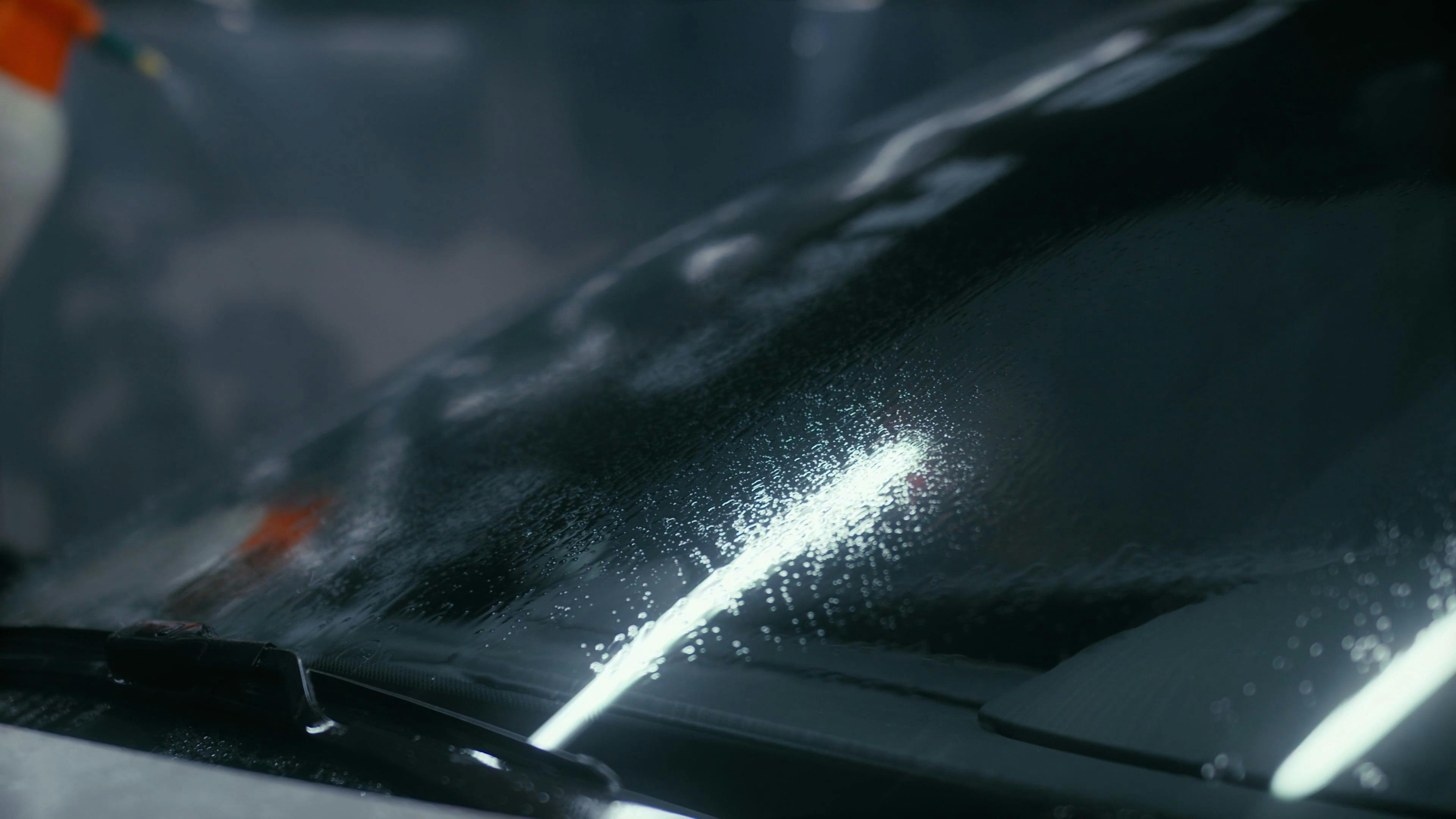 A Person Splashing Water on the Windshield Free Stock Video Footage ...