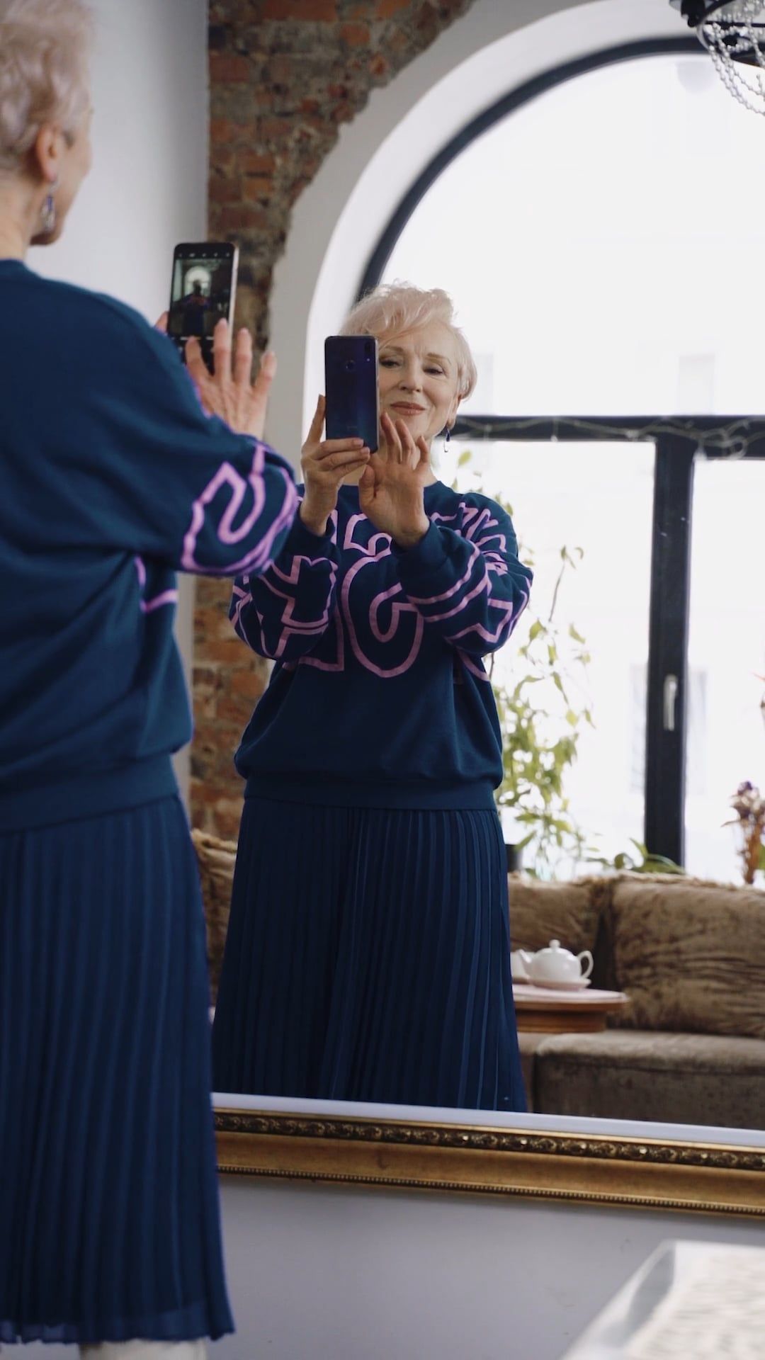 A Woman Taking Photos of Herself in a Mirror Reflection · Free Stock Video