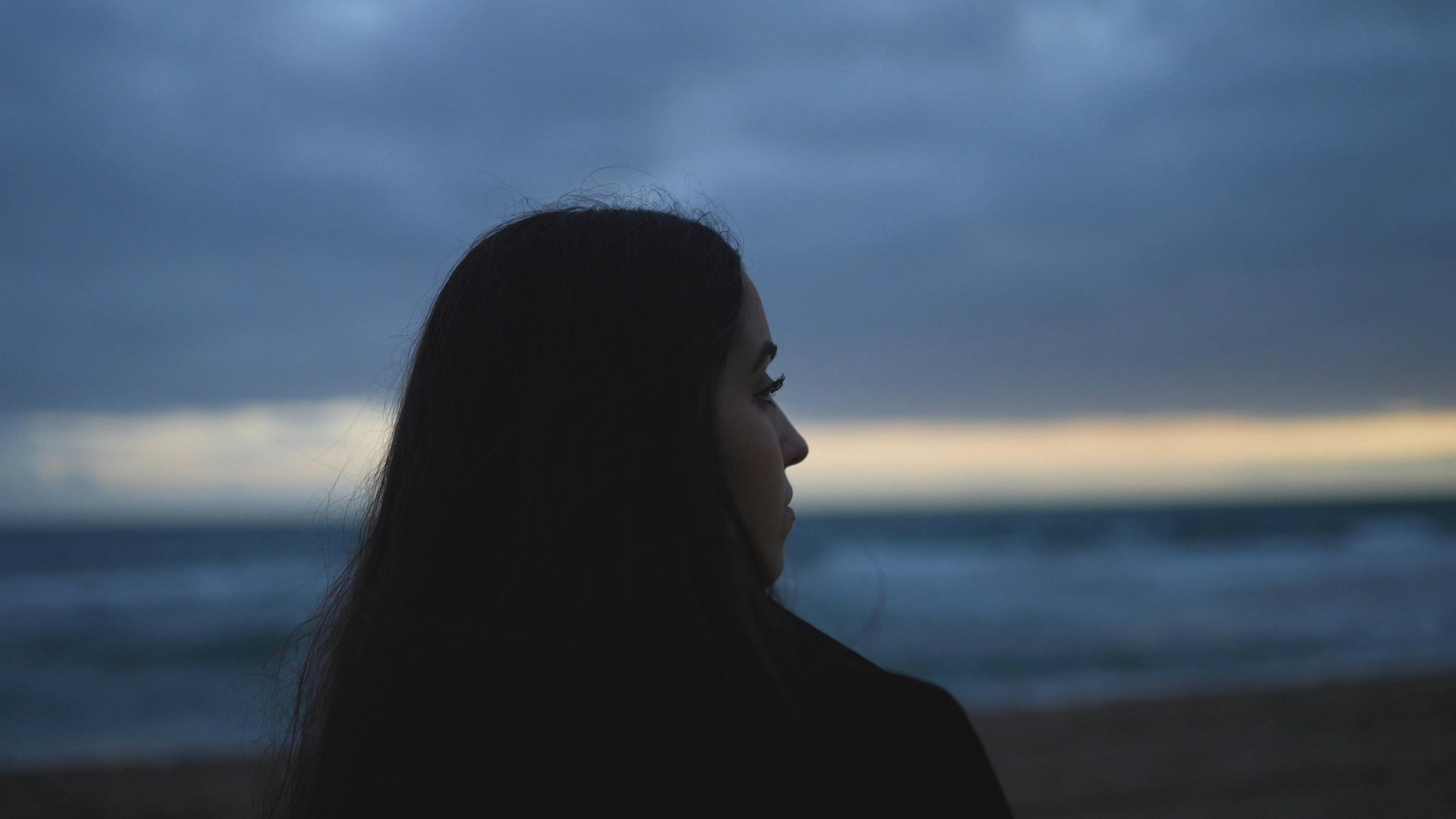 Woman Watching Sunset on the Shore · Free Stock Video