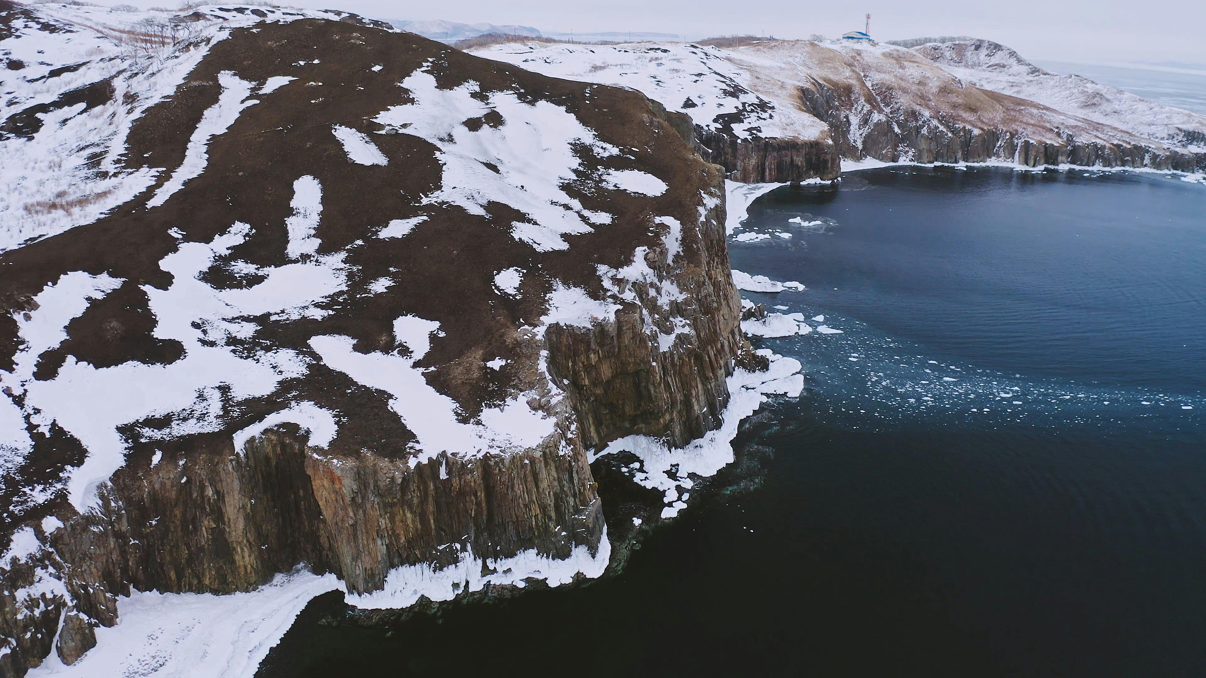 A Footage of a Snow Covered Cliff · Free Stock Video