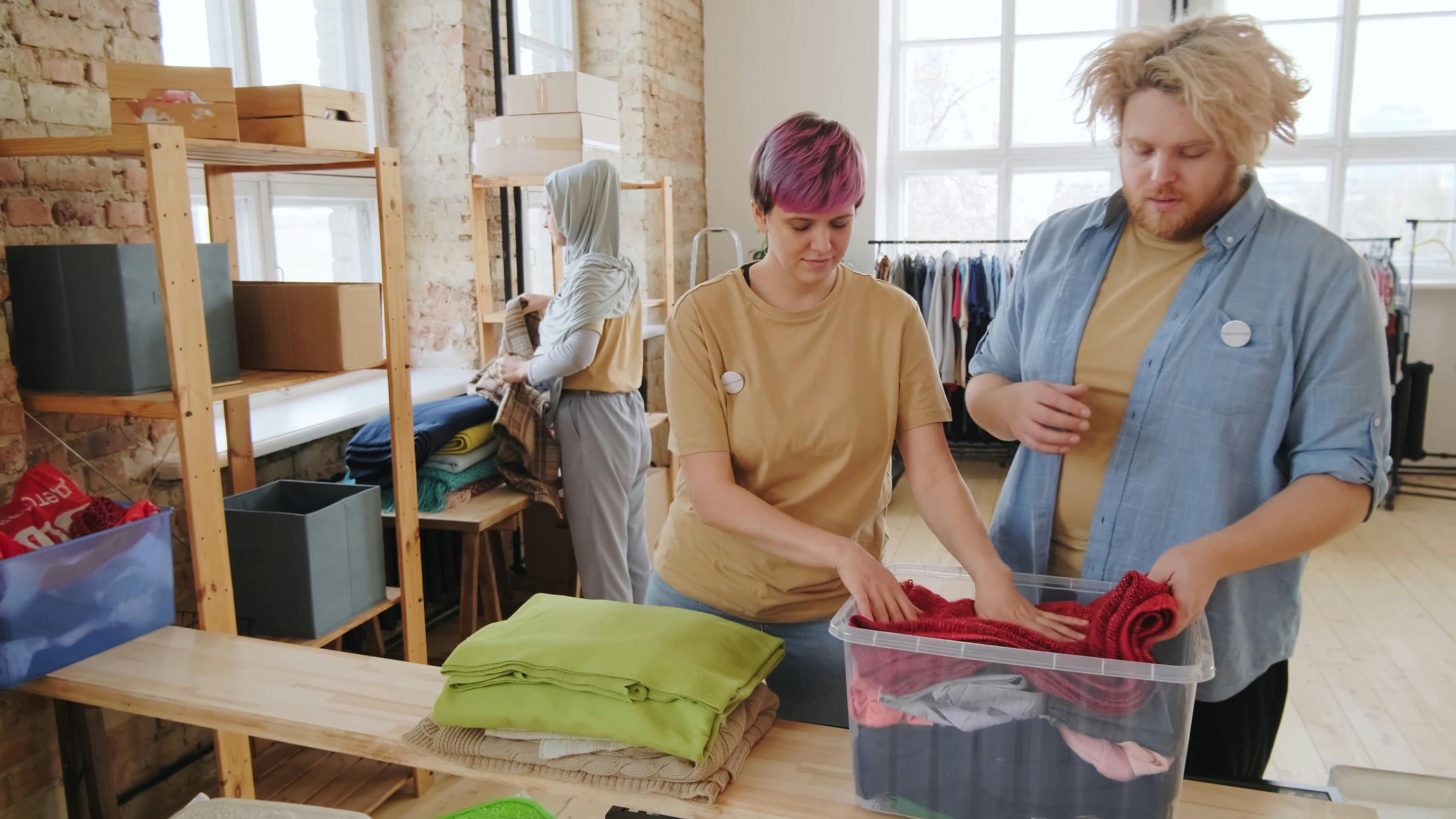 People Packing Clothes · Free Stock Video