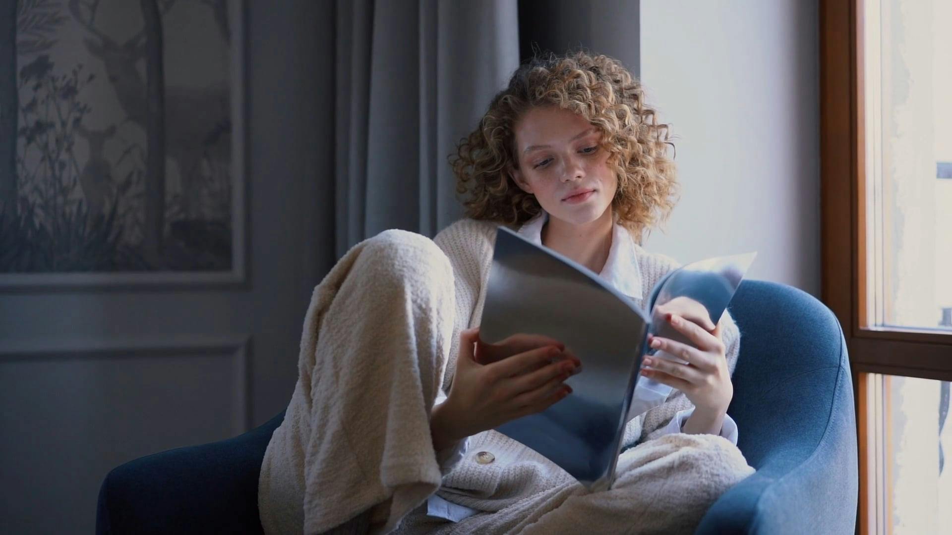 A Beautiful Woman Browsing a Magazine Free Stock Video Footage, Royalty ...