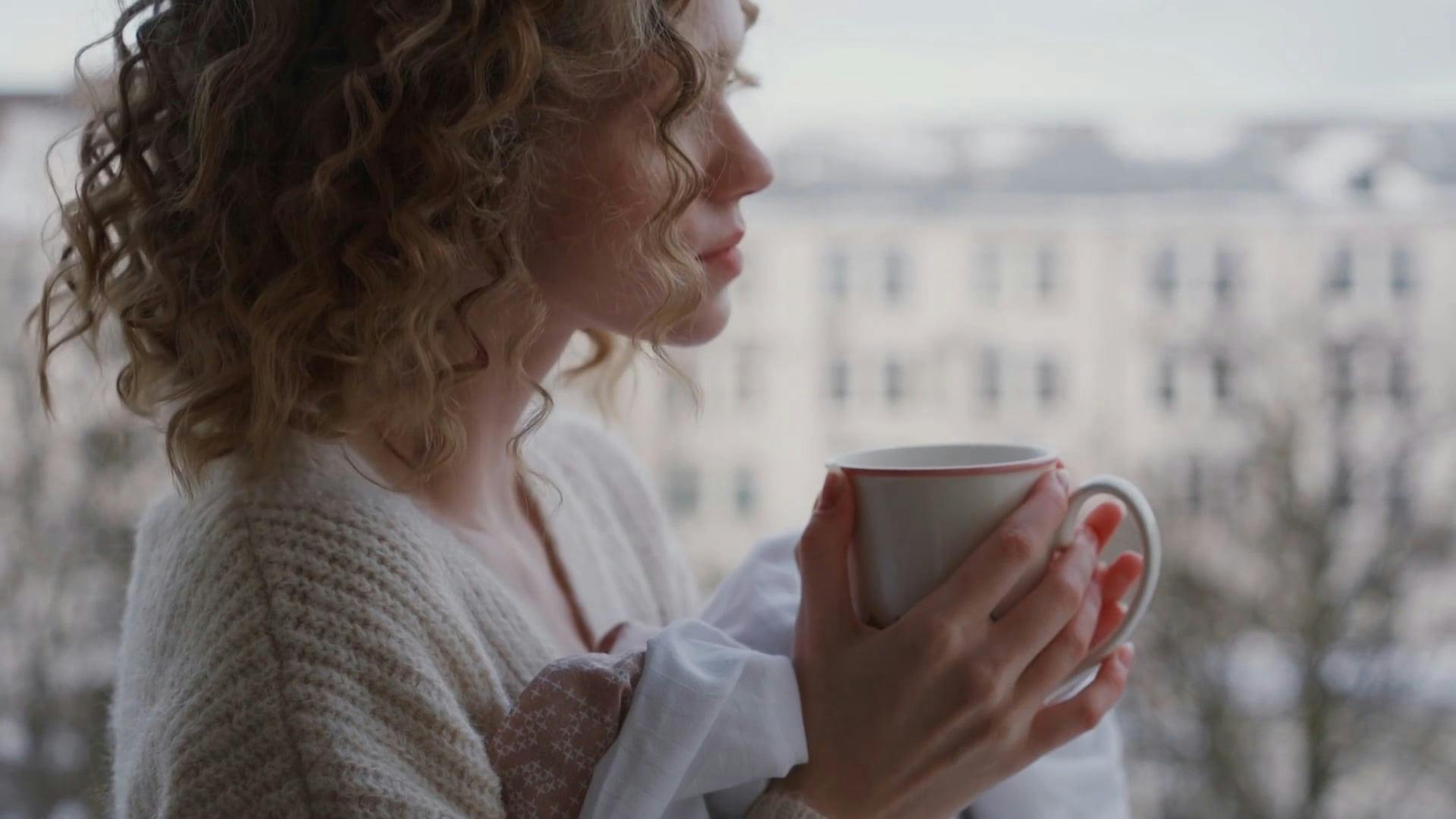 A Woman Sipping from a Cup while Outside · Free Stock Video