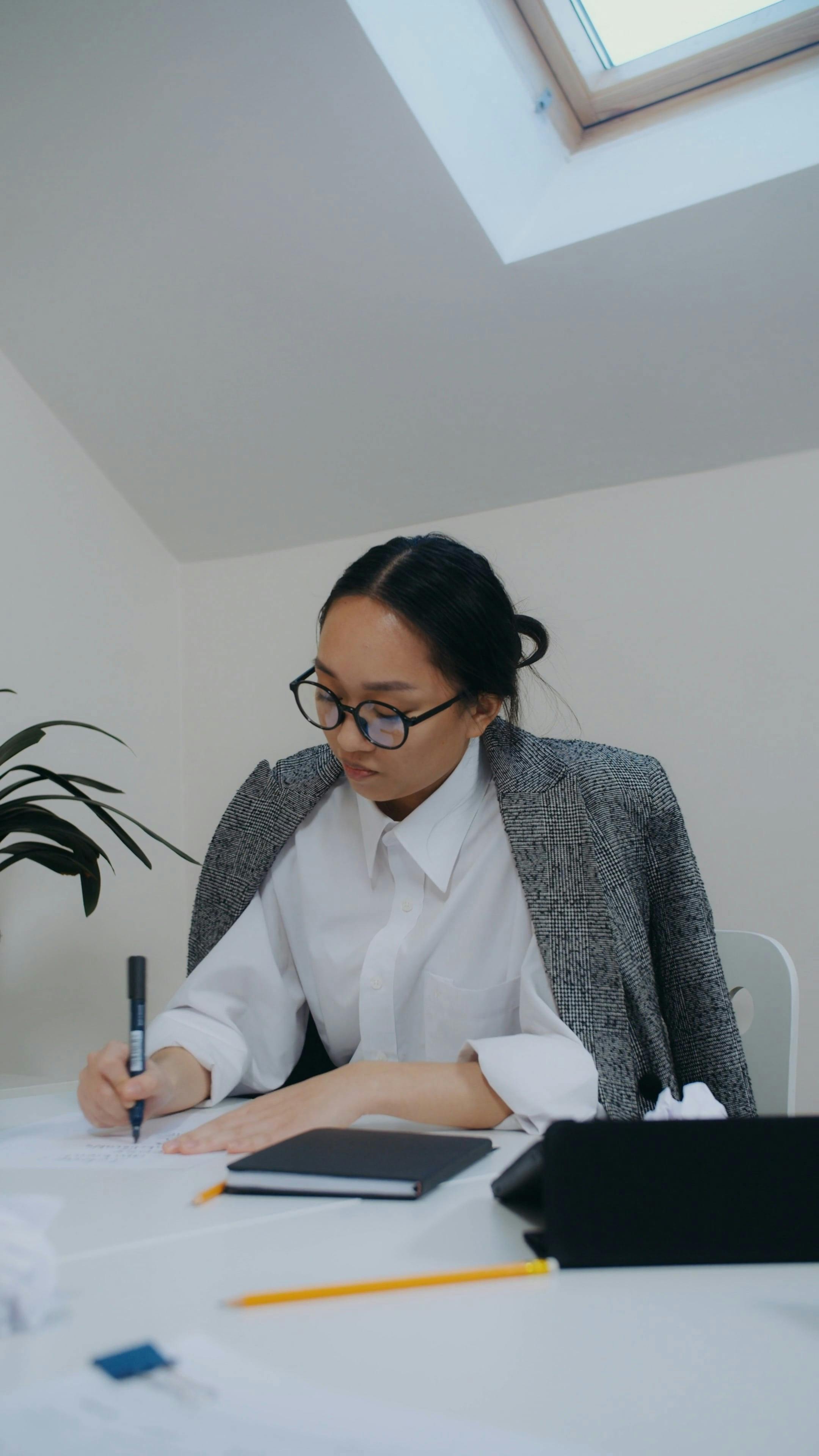 Frustrated Woman Writing on a Paper · Free Stock Video