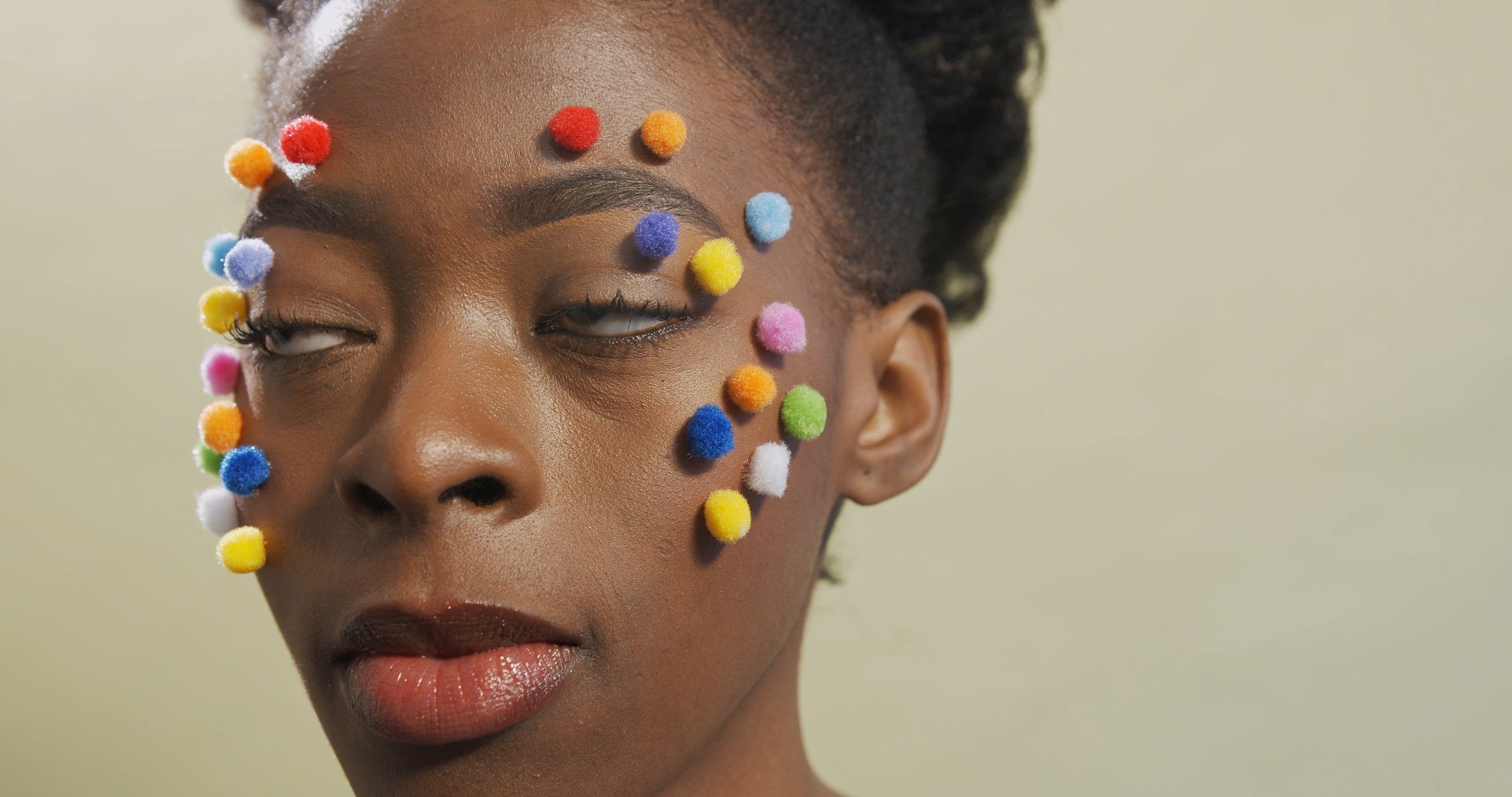 A Woman with Colorful Balls on Her Face Free Stock Video Footage ...