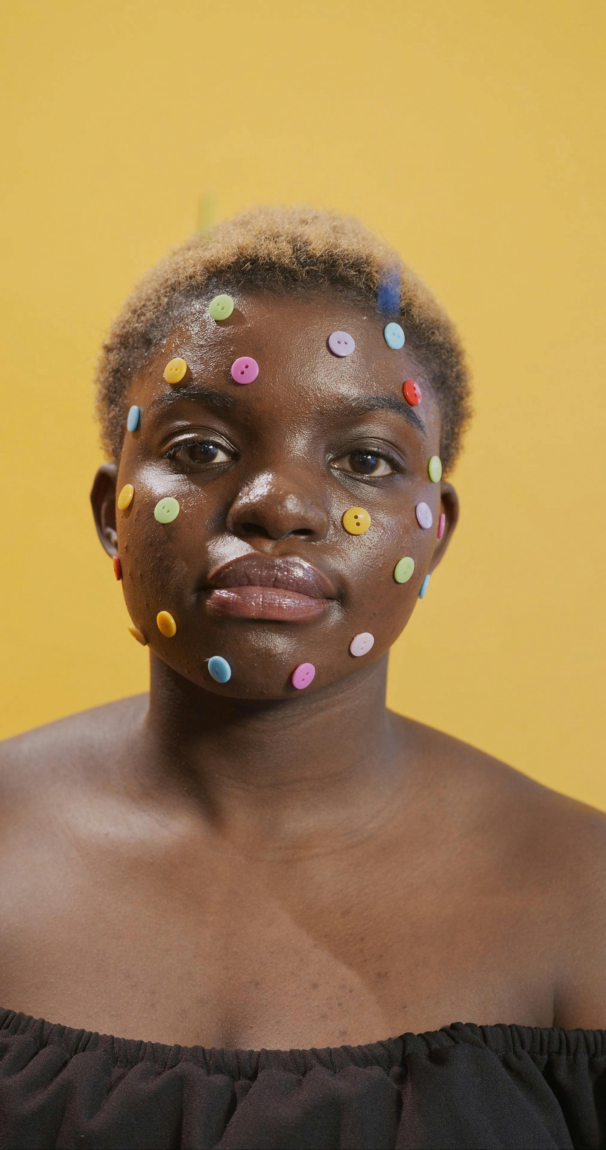 Portrait of Woman With Buttons Glued to Face · Free Stock Video