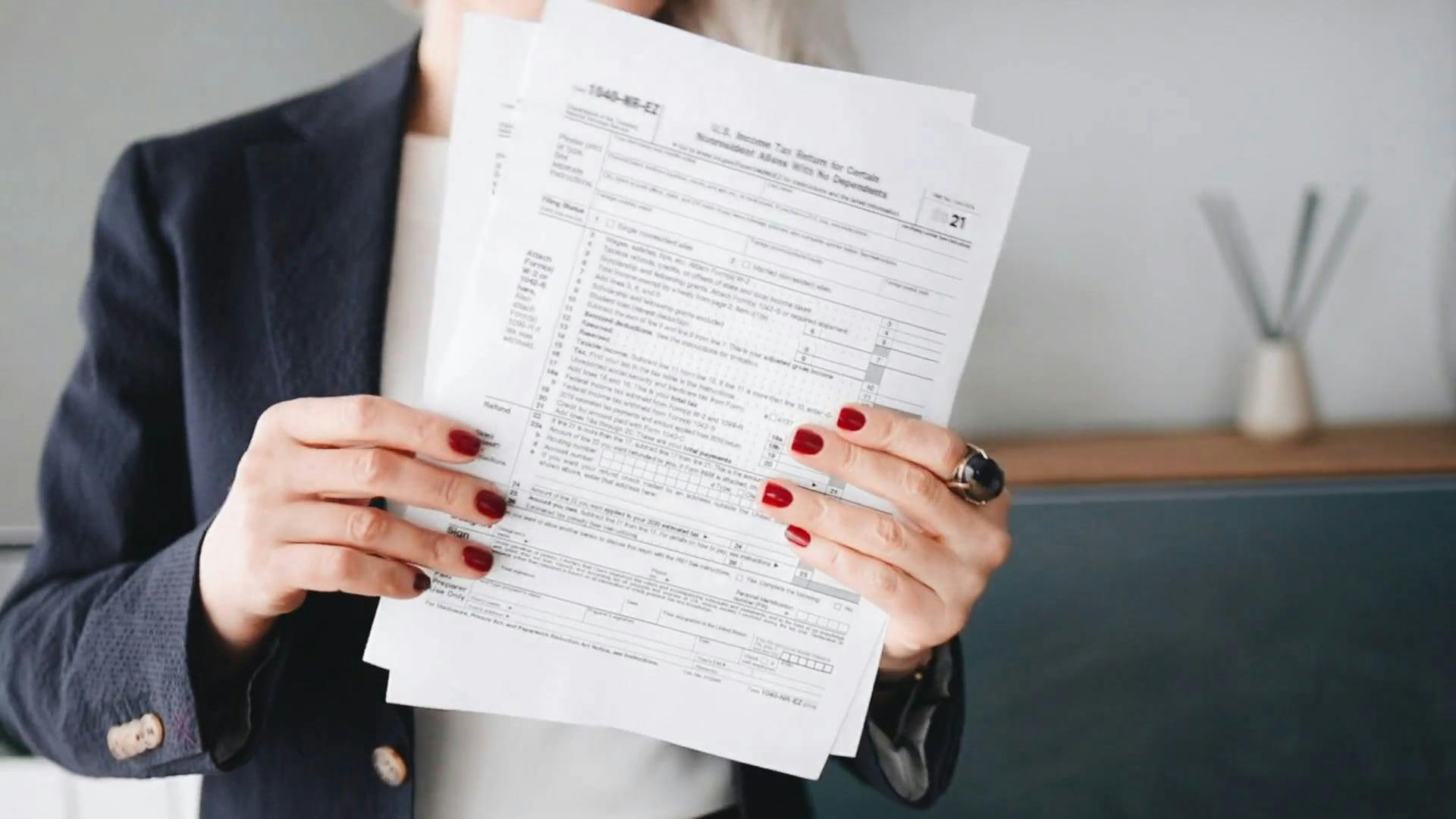 A Woman Showing and Explaining Documents Free Stock Video Footage ...
