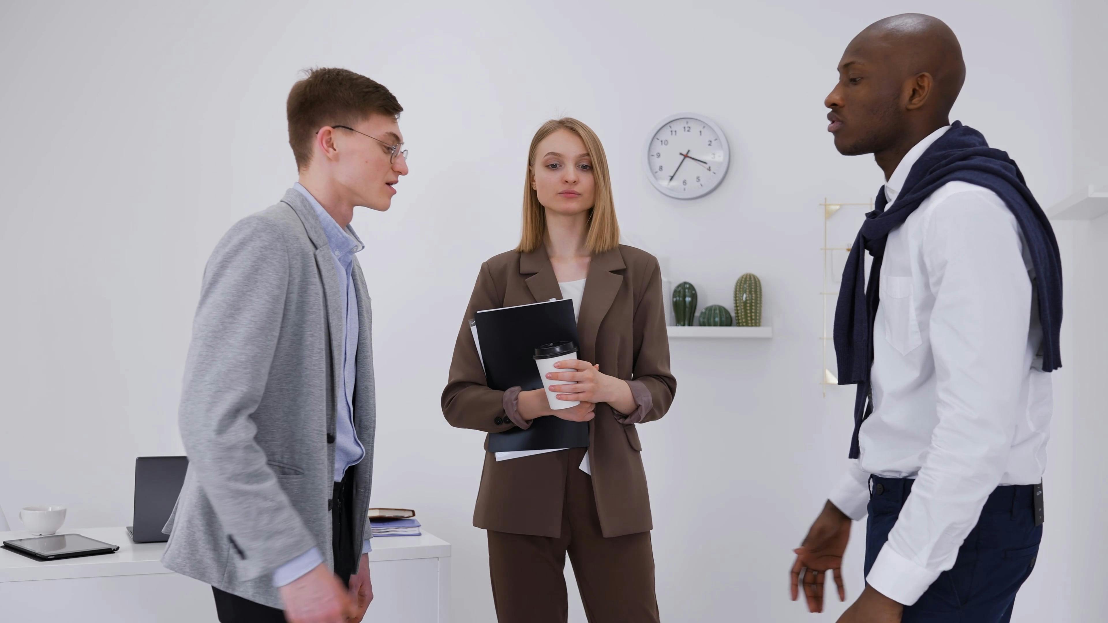 Coworkers Shaking Hands and Talking at an Office · Free Stock Video