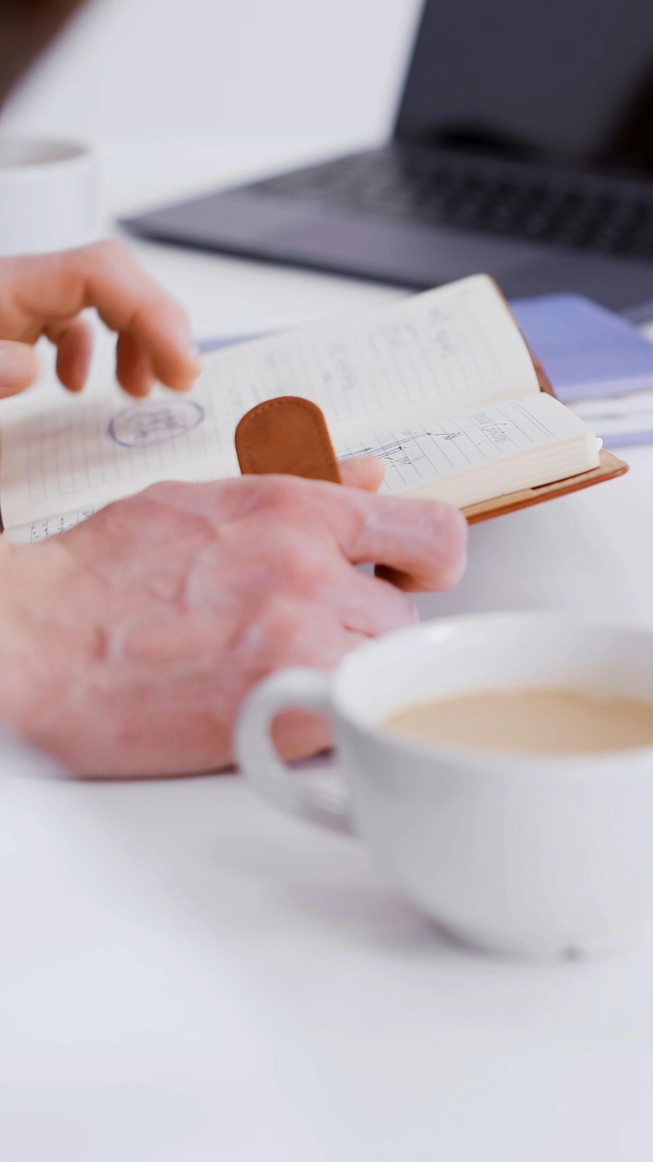 Person Reading a Notebook · Free Stock Video