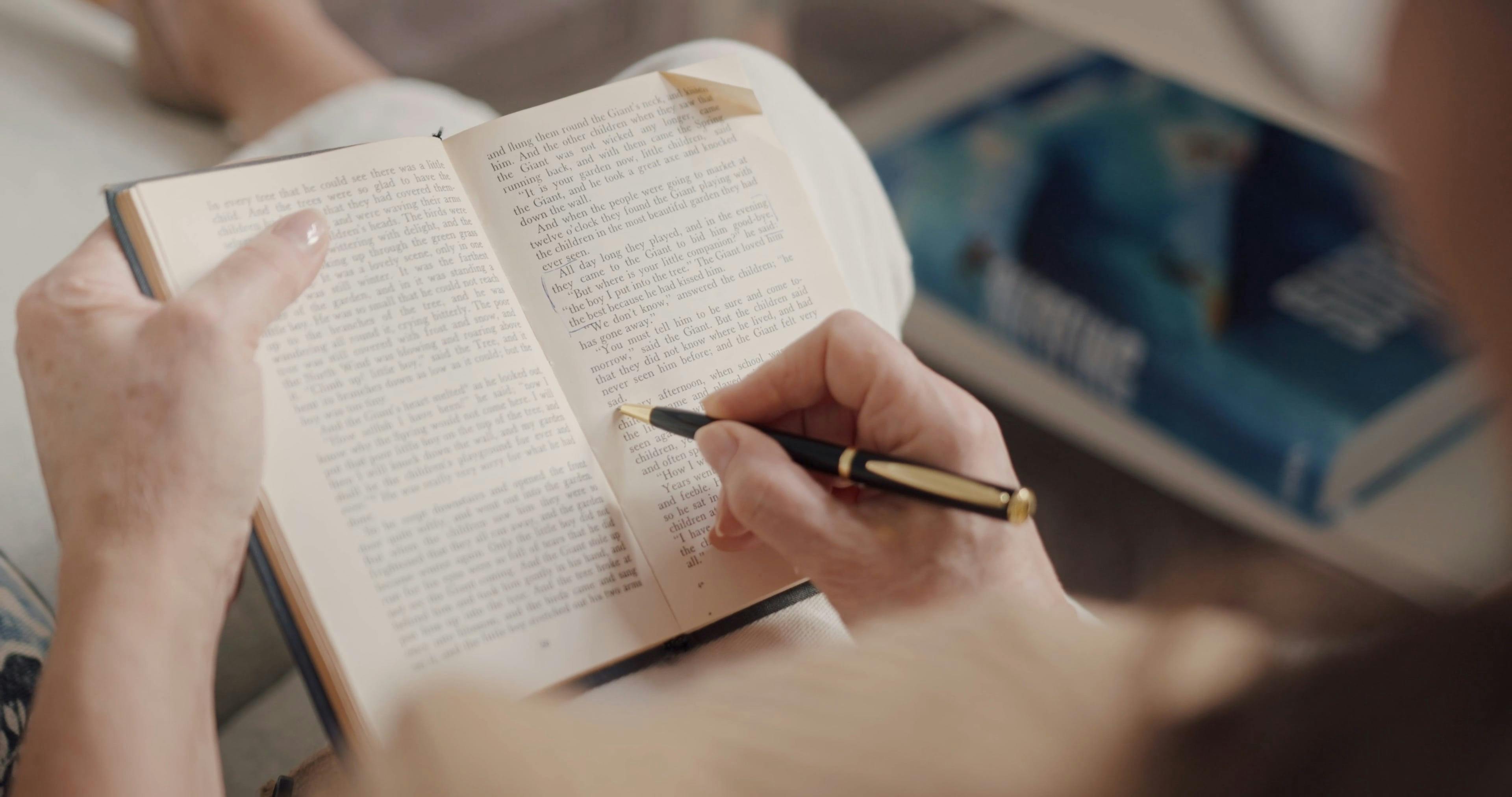Close Up Video of a Person Writing on a Book · Free Stock Video