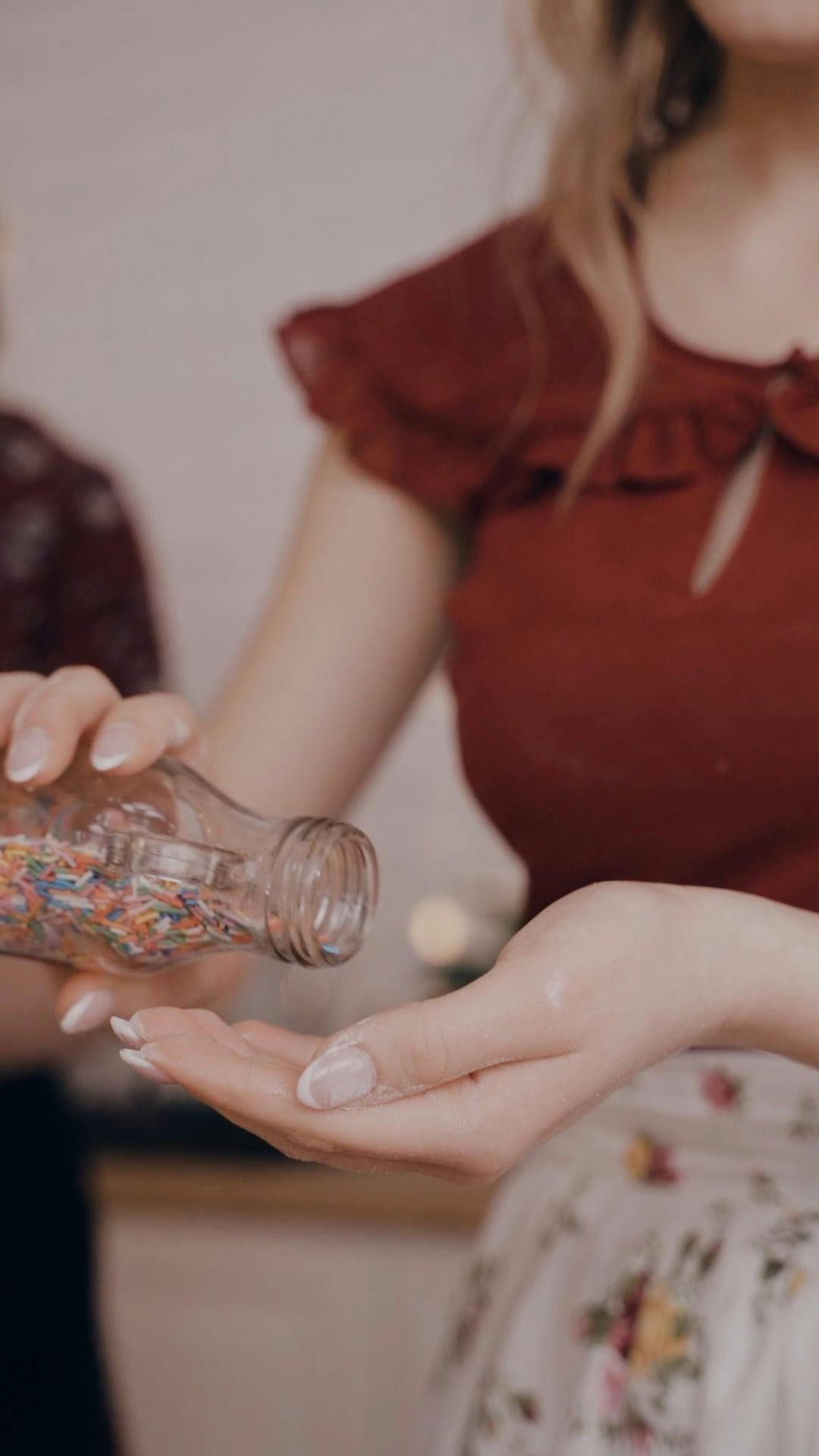 A Person Pouring Sprinkle on Her Hand · Free Stock Video