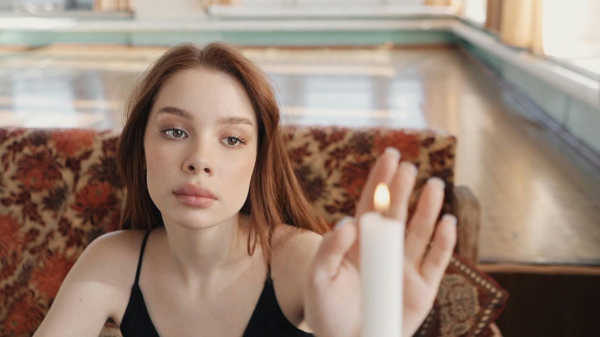 A Woman Touching a Lighted Candle Free Stock Video Footage, Royalty ...