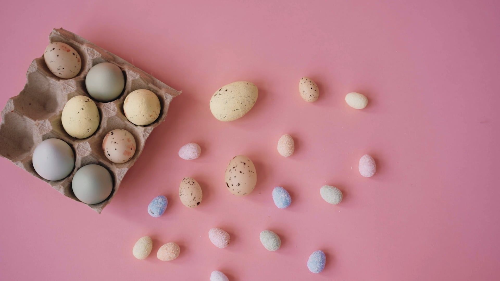 Colored Eggs on a Pink Background · Free Stock Video