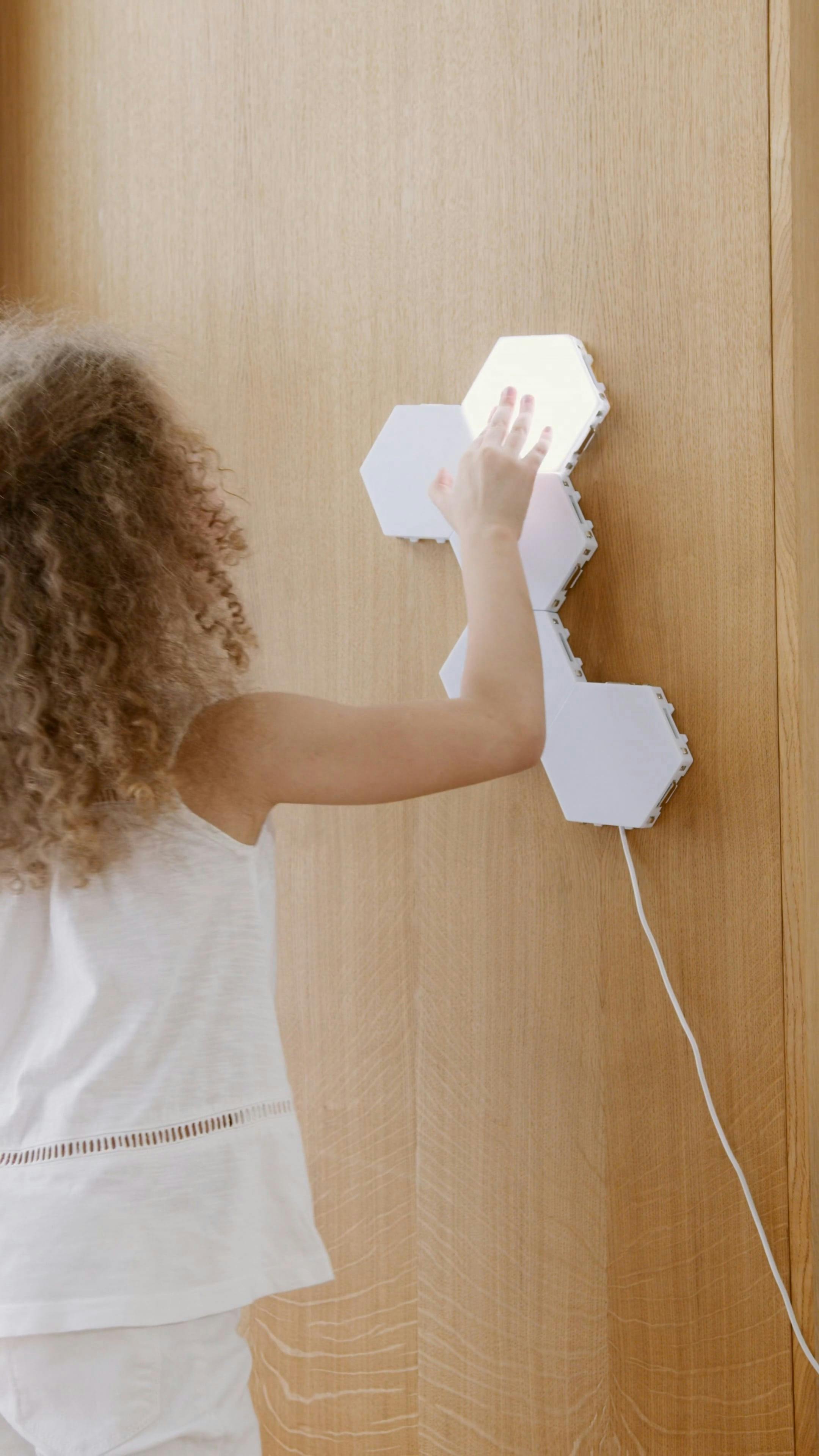 Two Kids Touching the Hexagonal Lights · Free Stock Video