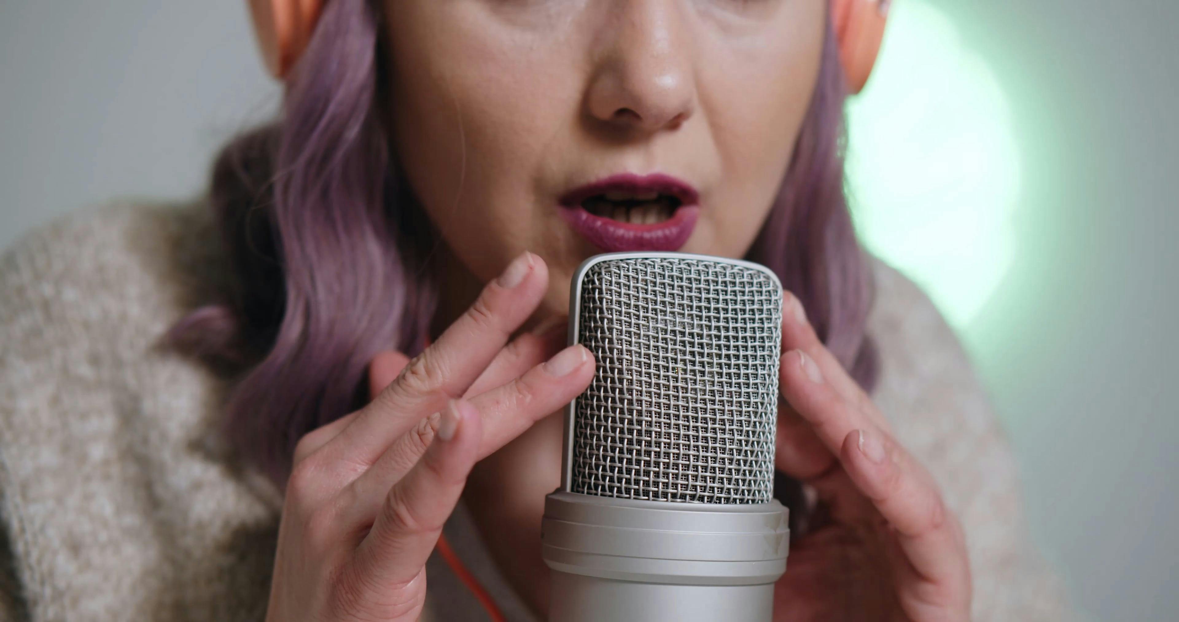 A Woman Tapping a Condenser Microphone · Free Stock Video