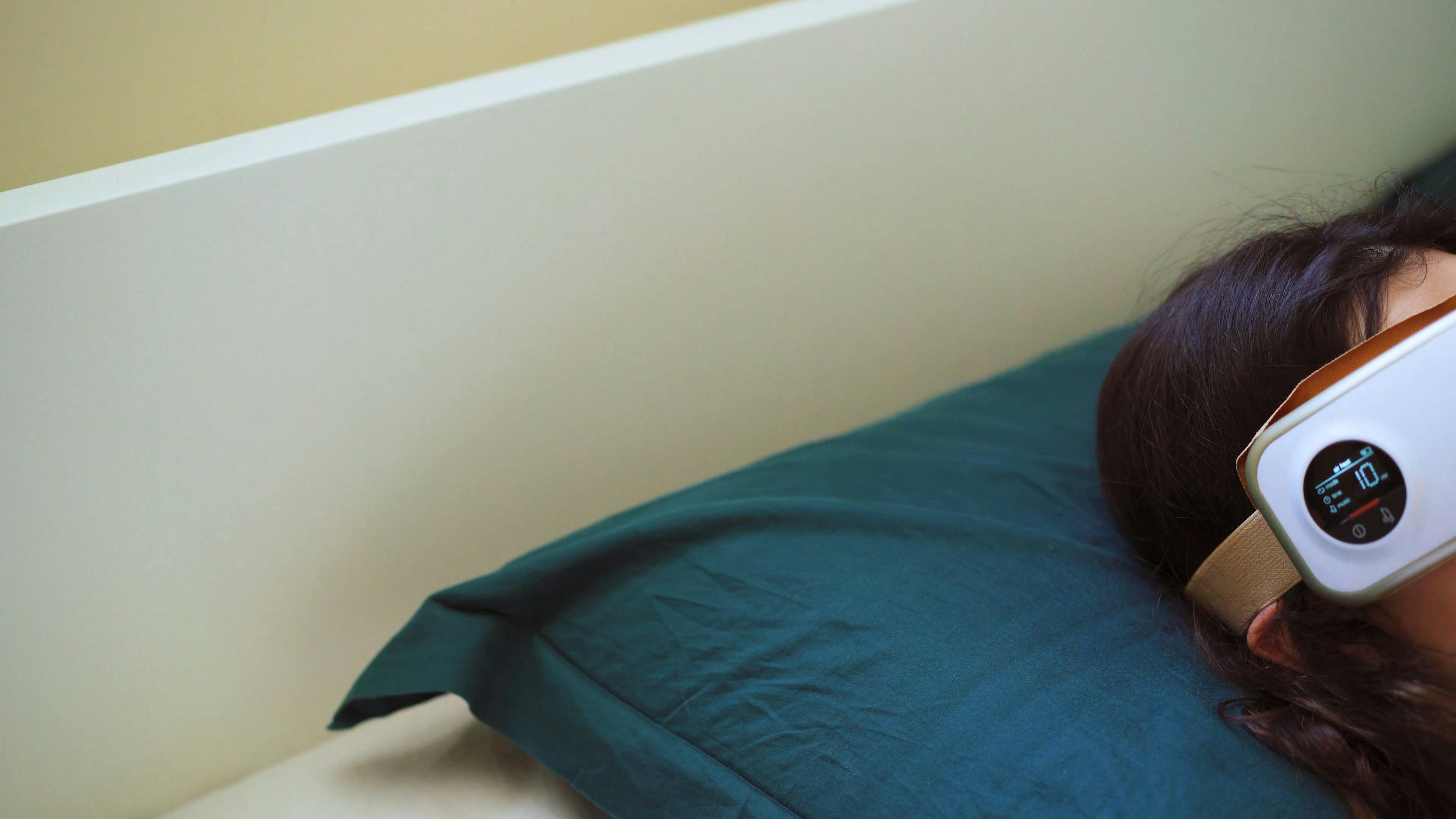 A Woman Laying Down on a Bed While Wearing VR Goggles Free Stock Video ...