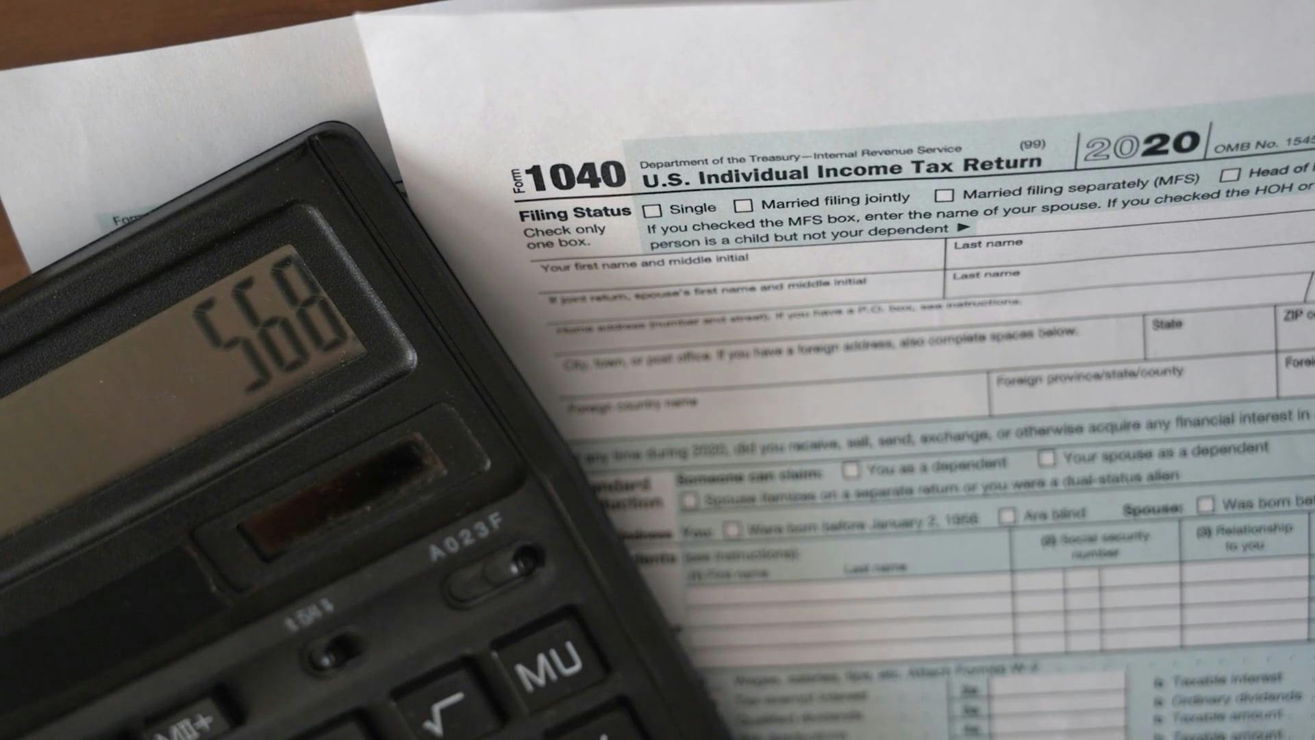 A Calculator and a Tax Form · Free Stock Video