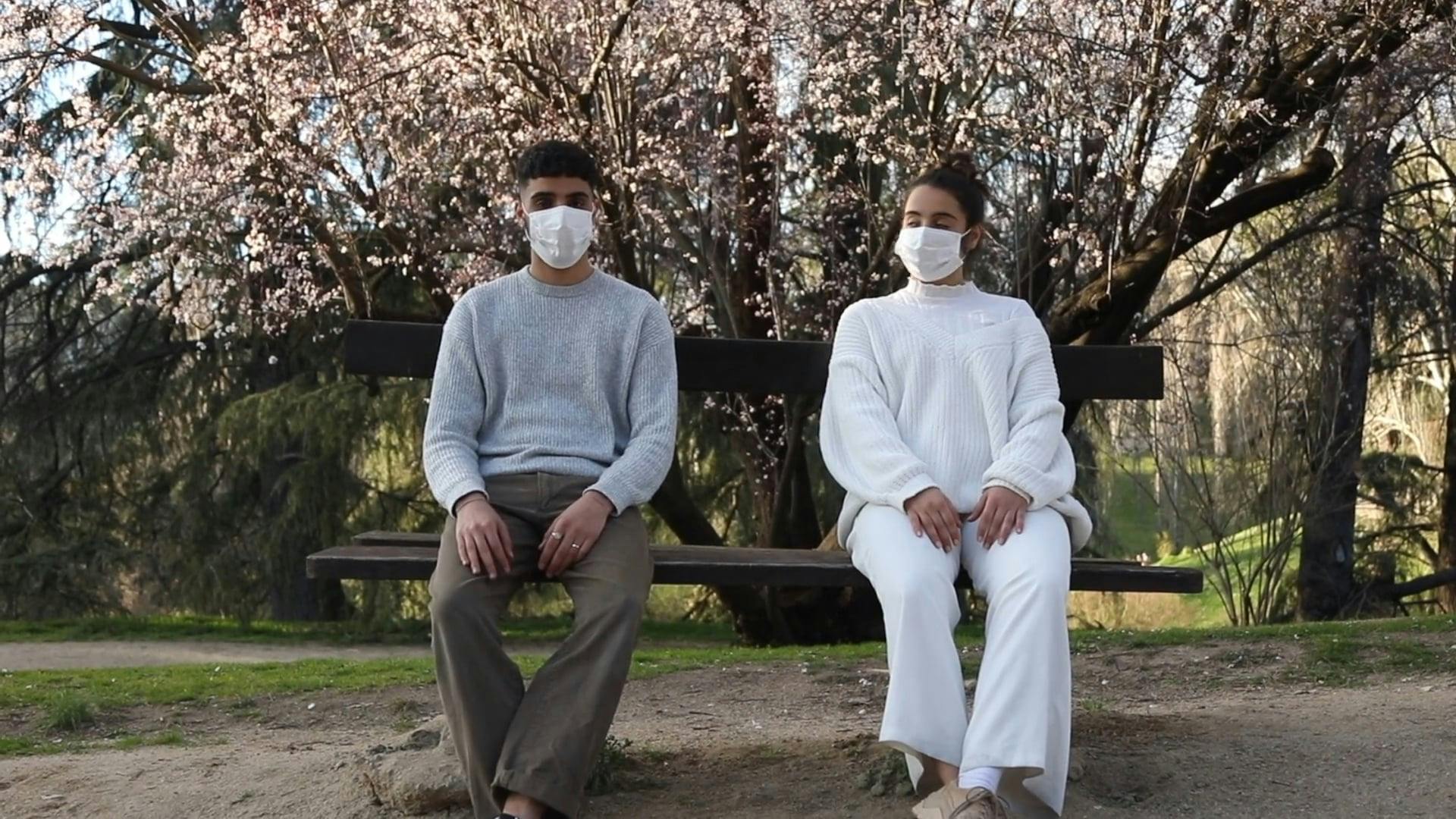 Man and Woman Wearing Facemask While Sitting with Social Distancing ...