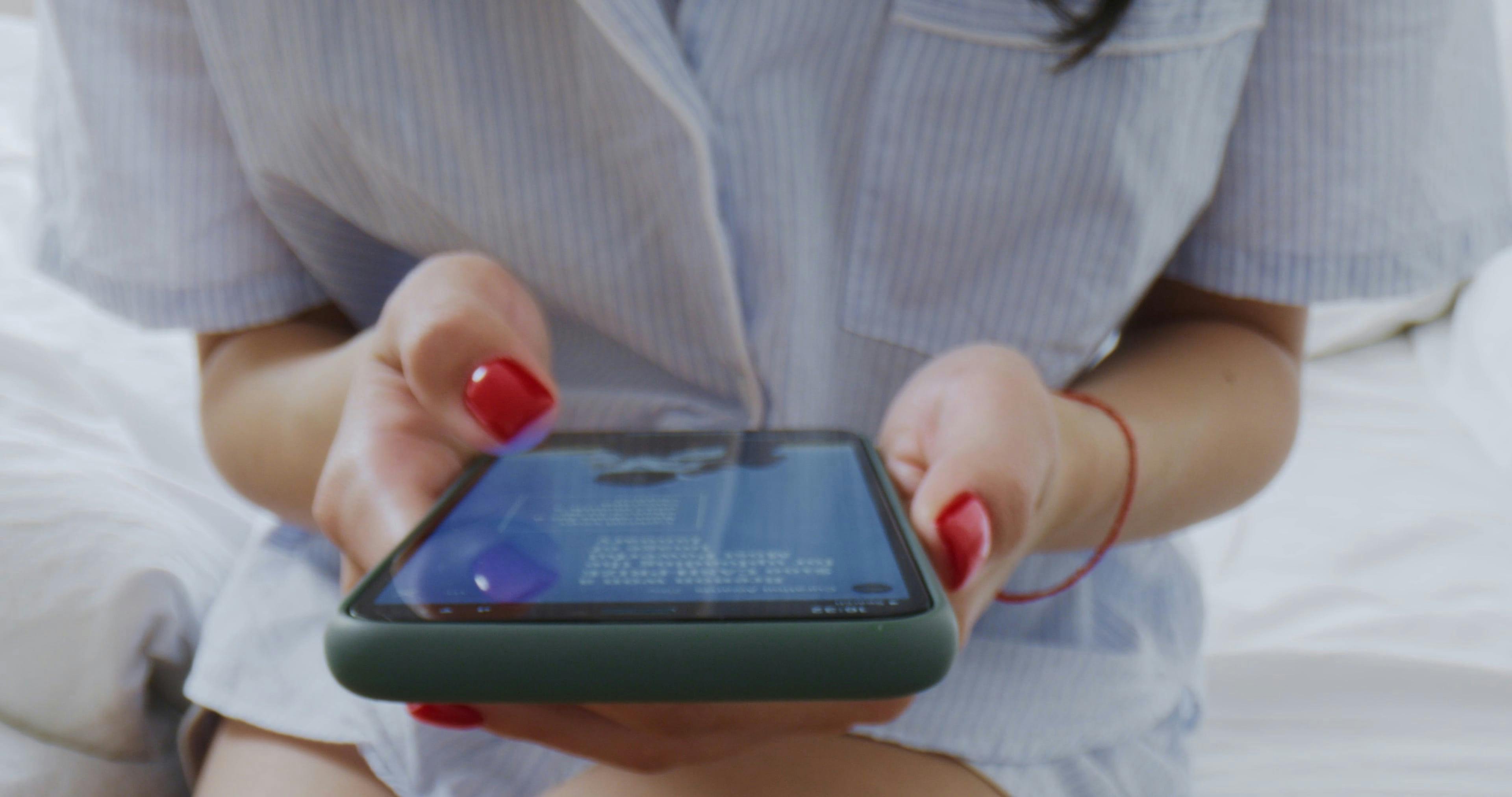 Woman Browsing on her Smartphone · Free Stock Video