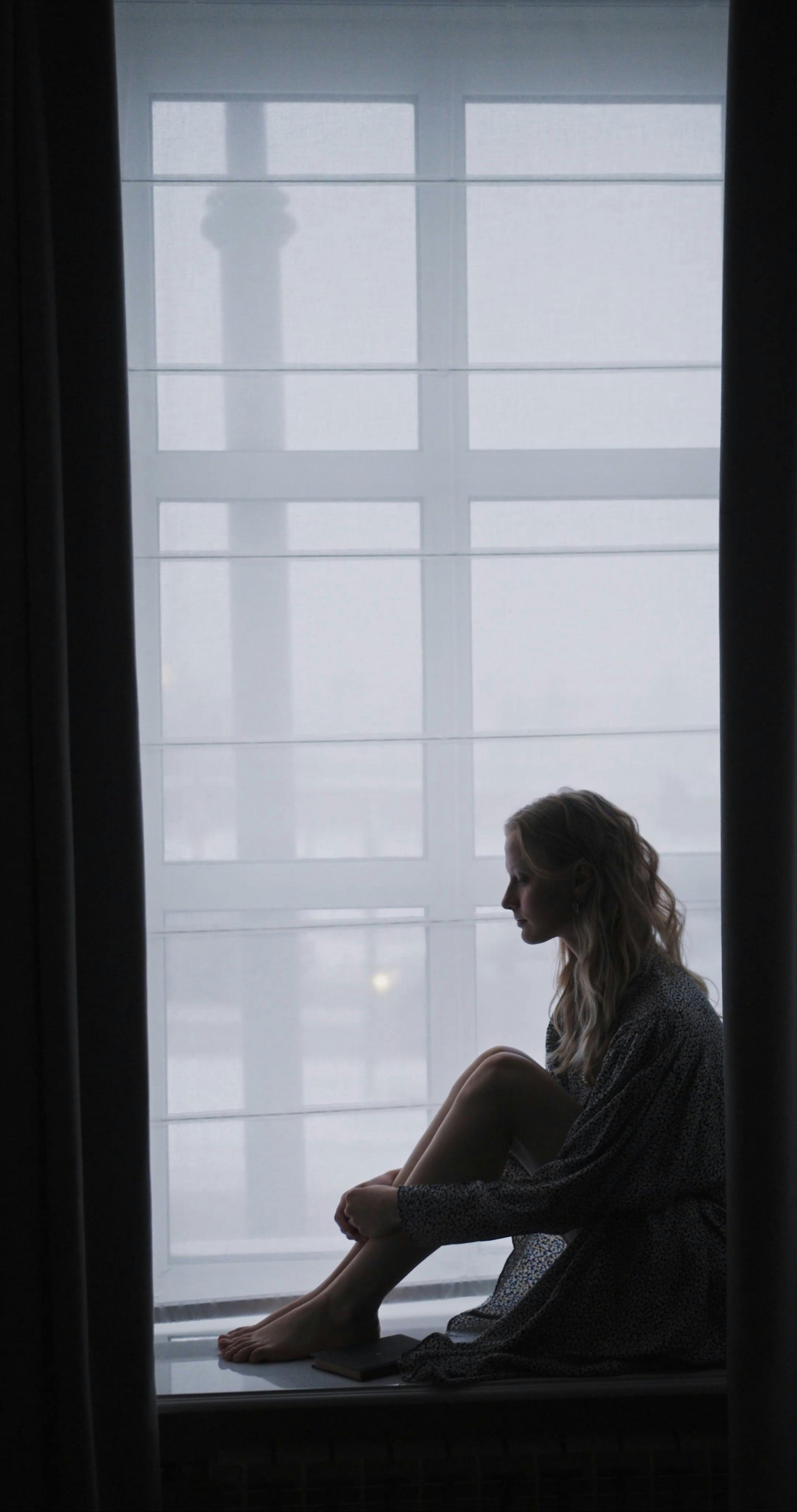 Woman Sitting By the Window · Free Stock Video