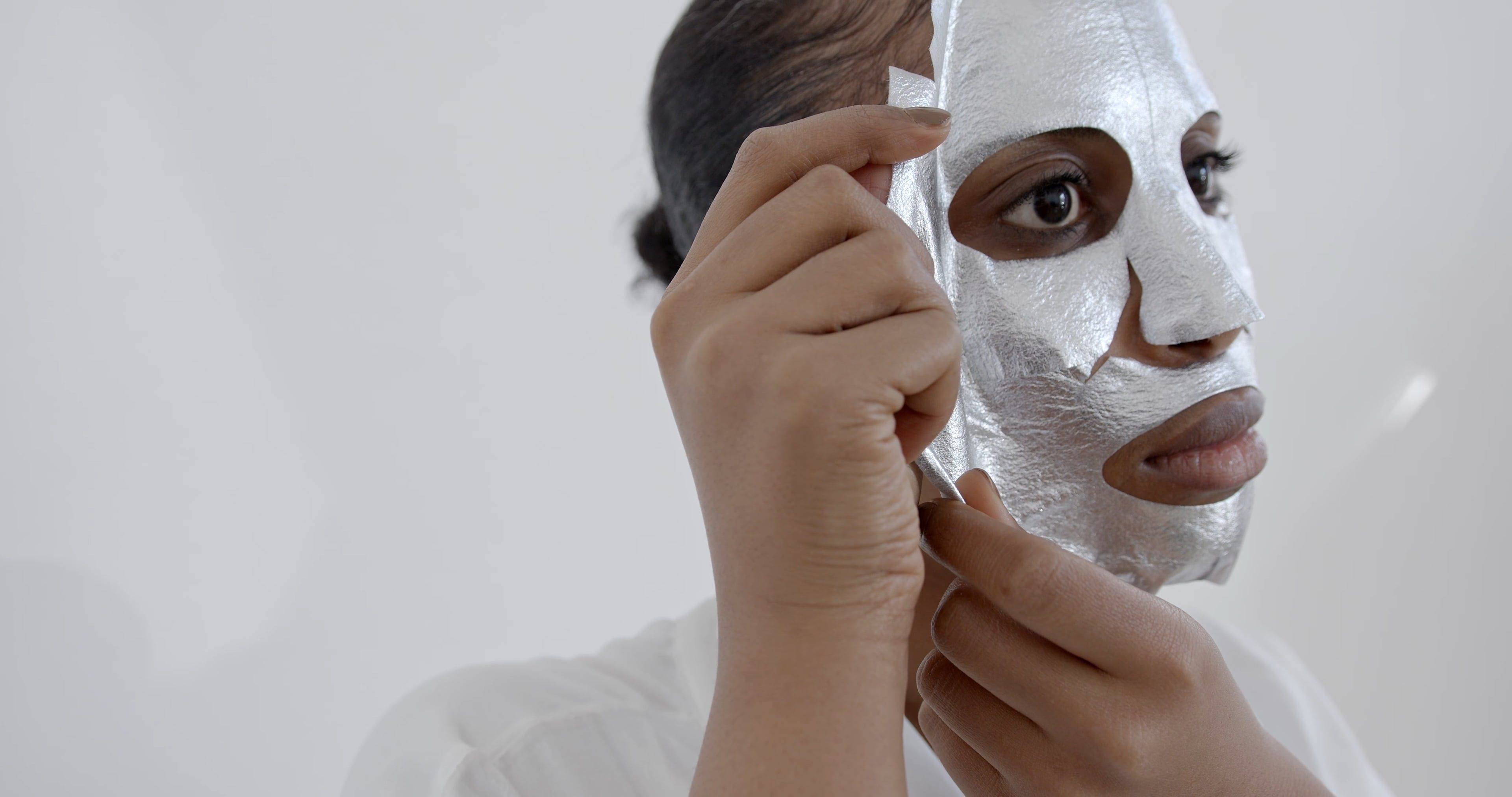 A Woman Putting a Facial Mask · Free Stock Video