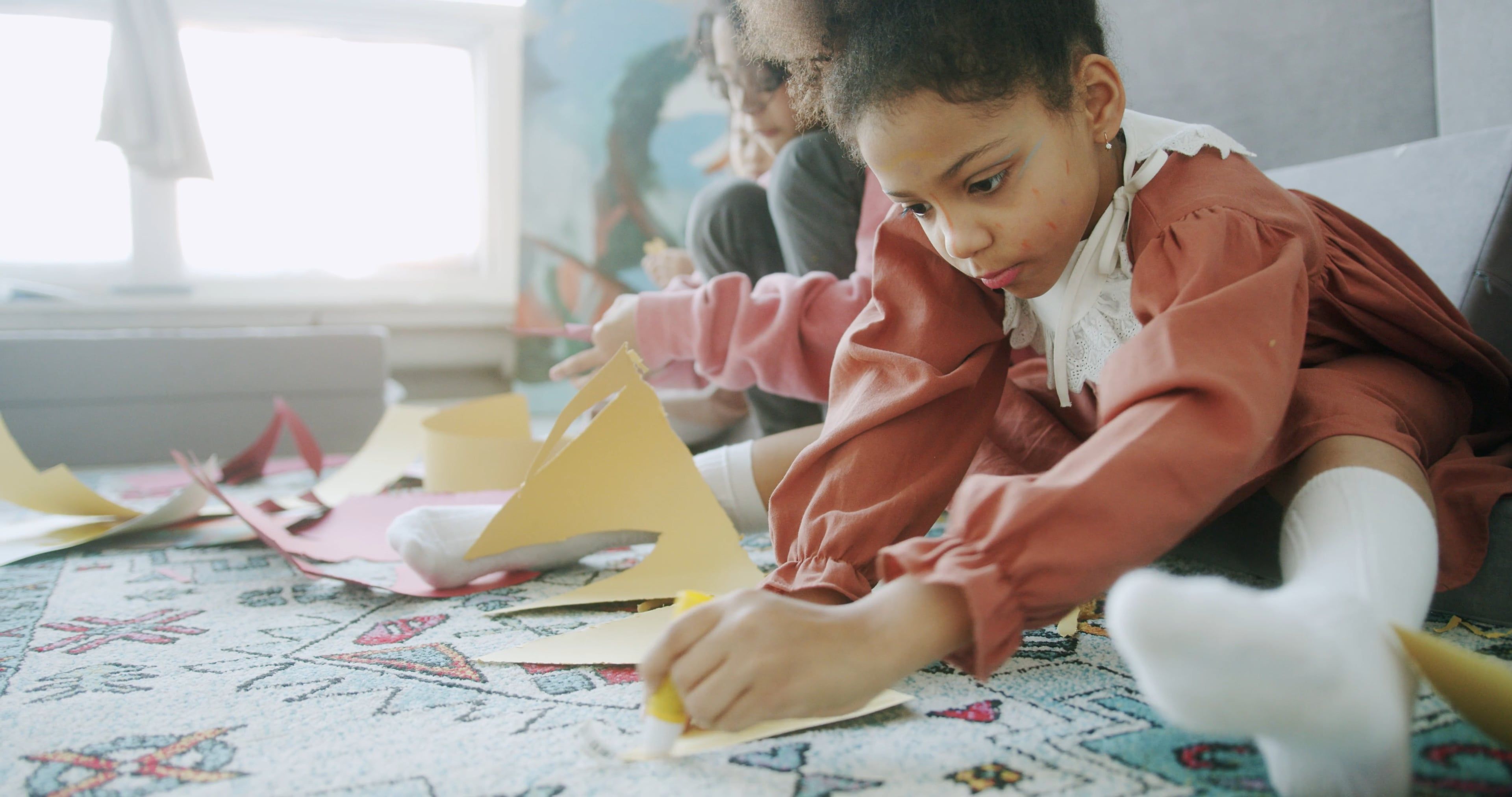 A Little Girl Applying Glue on Paper · Free Stock Video