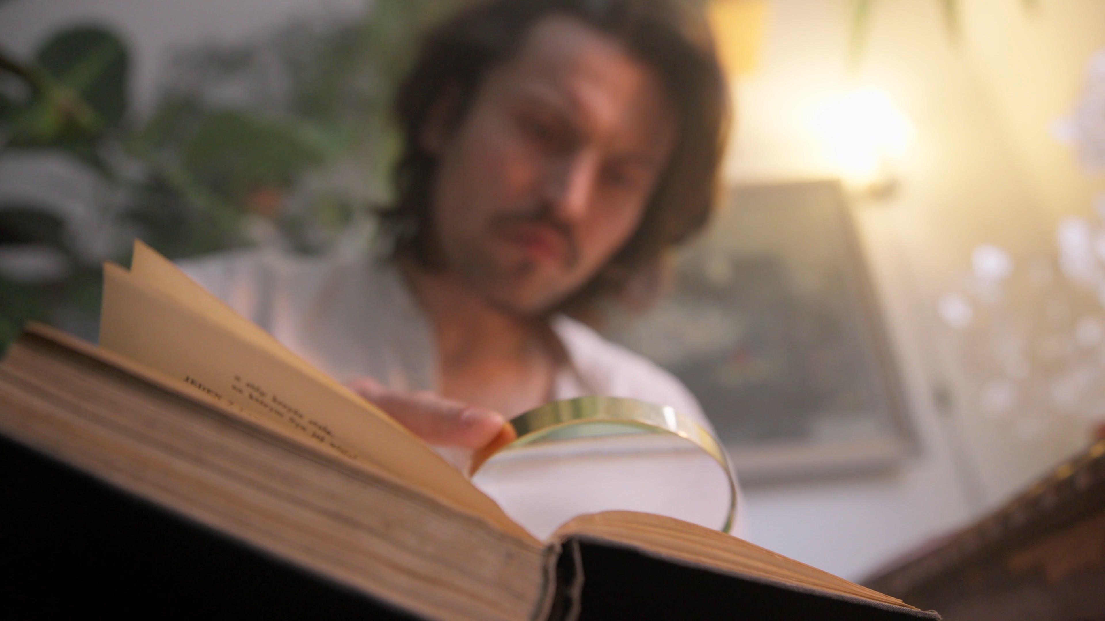 Man Reading with Magnifying Glass · Free Stock Video