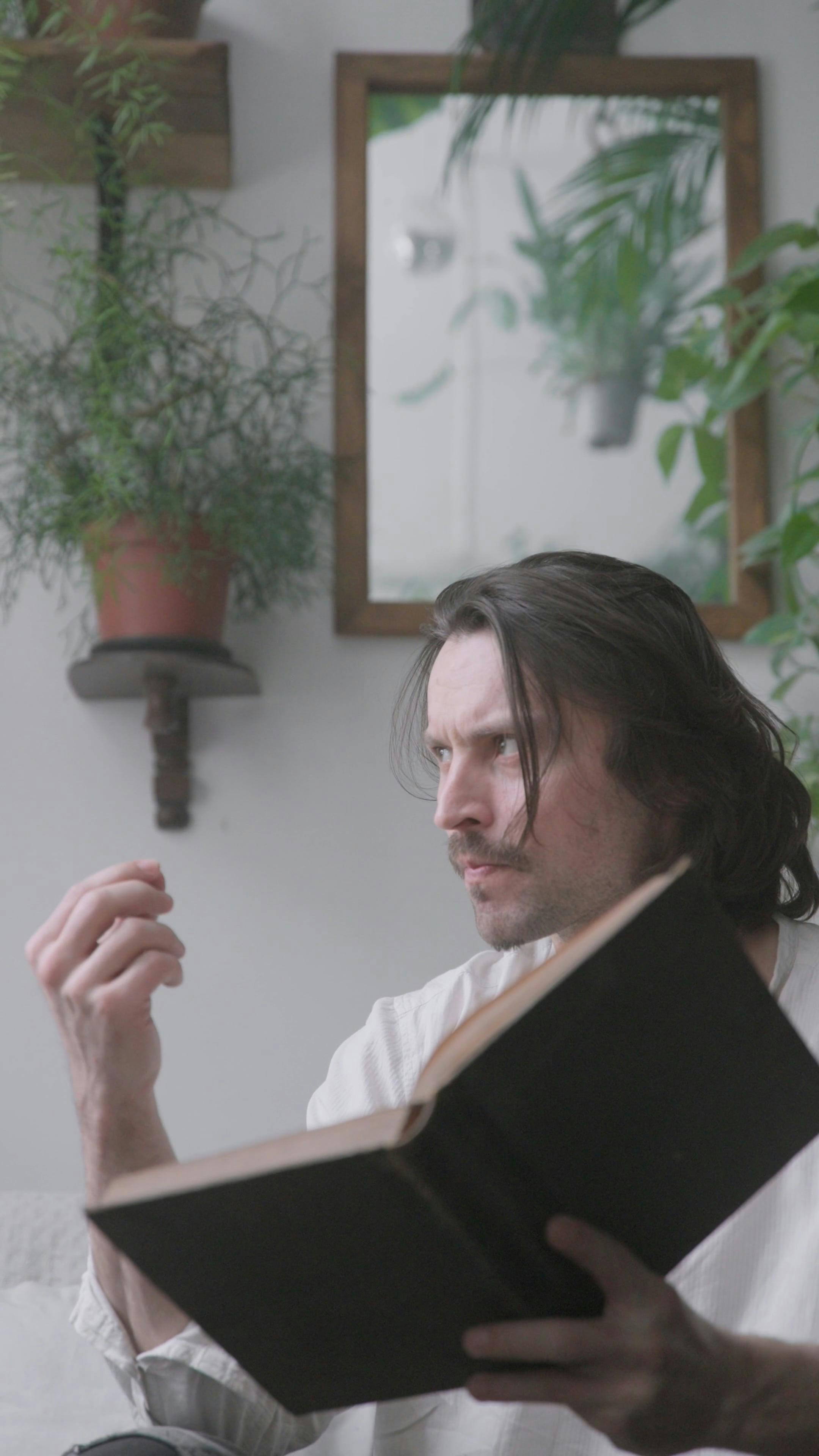 A Woman Reading A Book While Sitting On A Chair · Free Stock Video