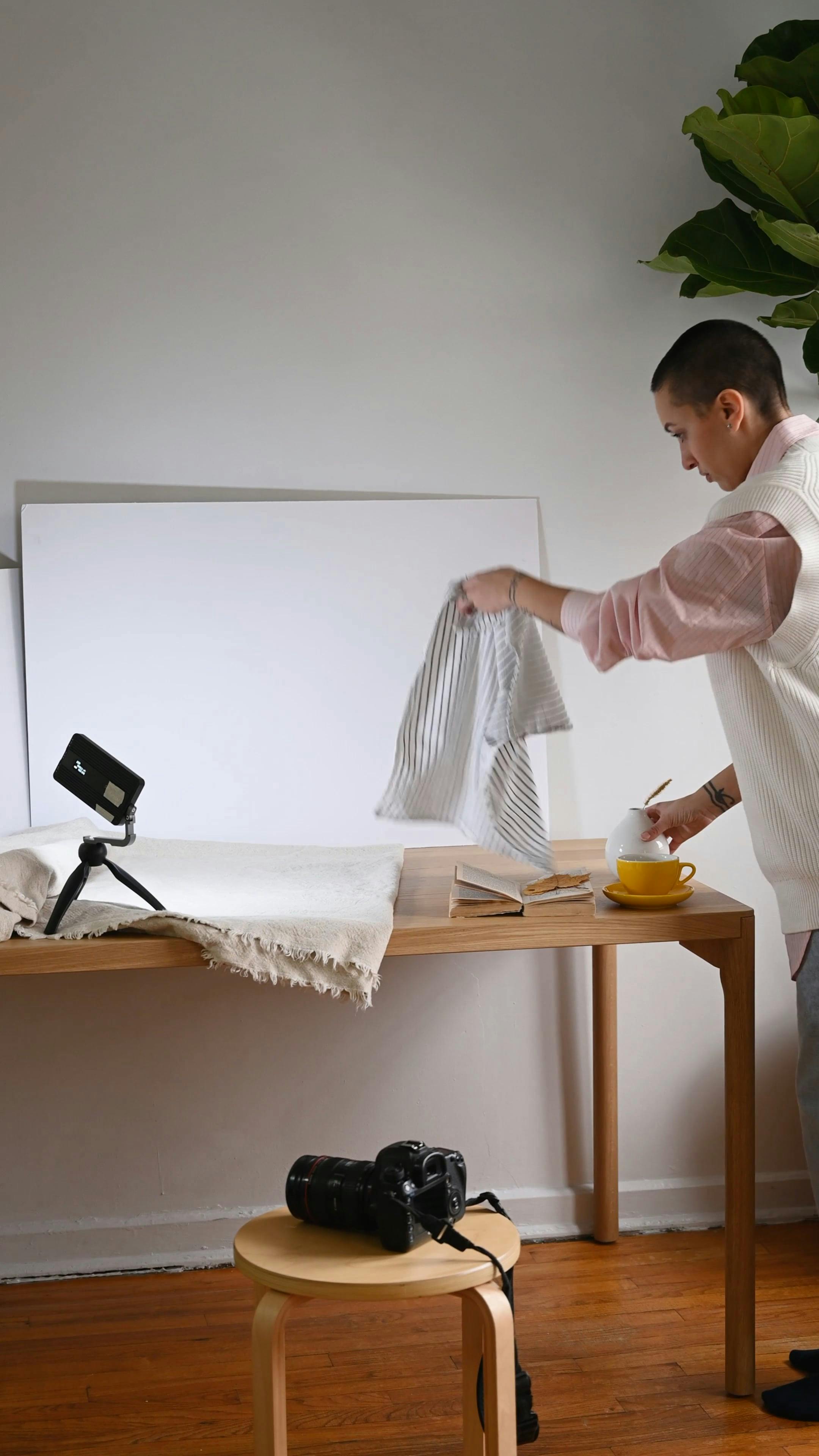 Woman Arranging Items Before Taking Picture Free Stock Video Footage ...