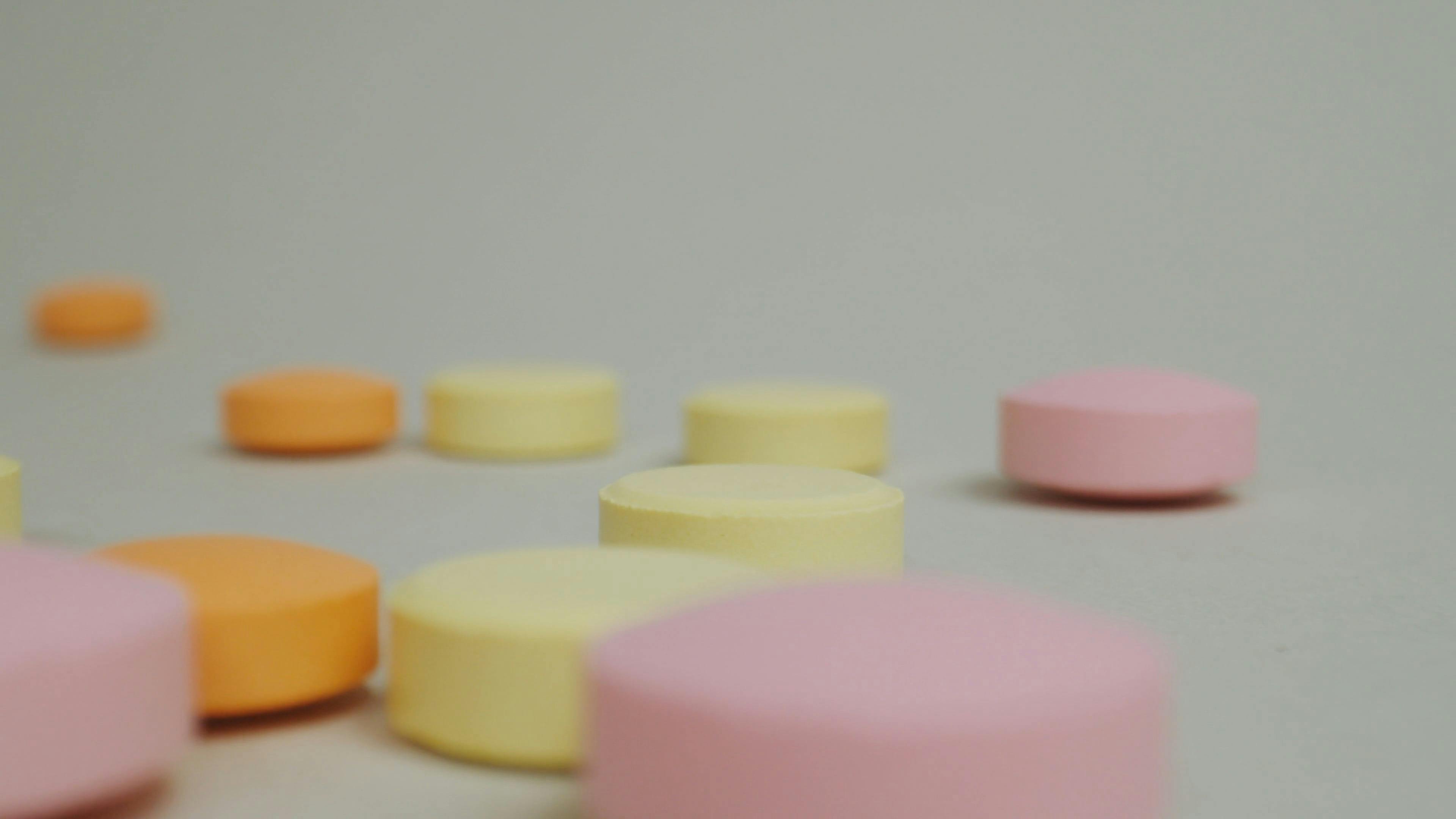 A Round Yellow Tablet · Free Stock Video