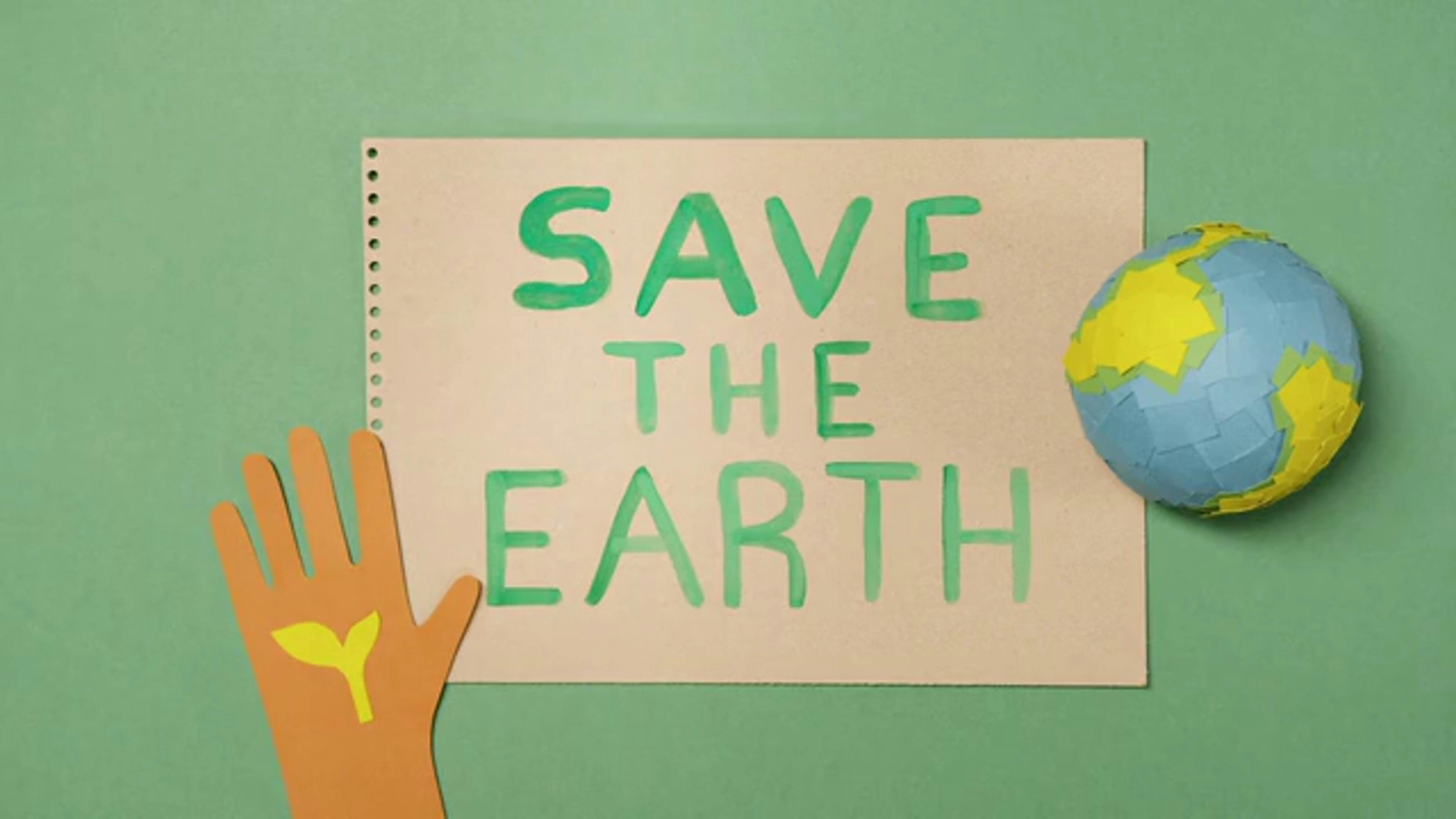 Save the Earth Written on a Paper Free Stock Video Footage, Royalty ...