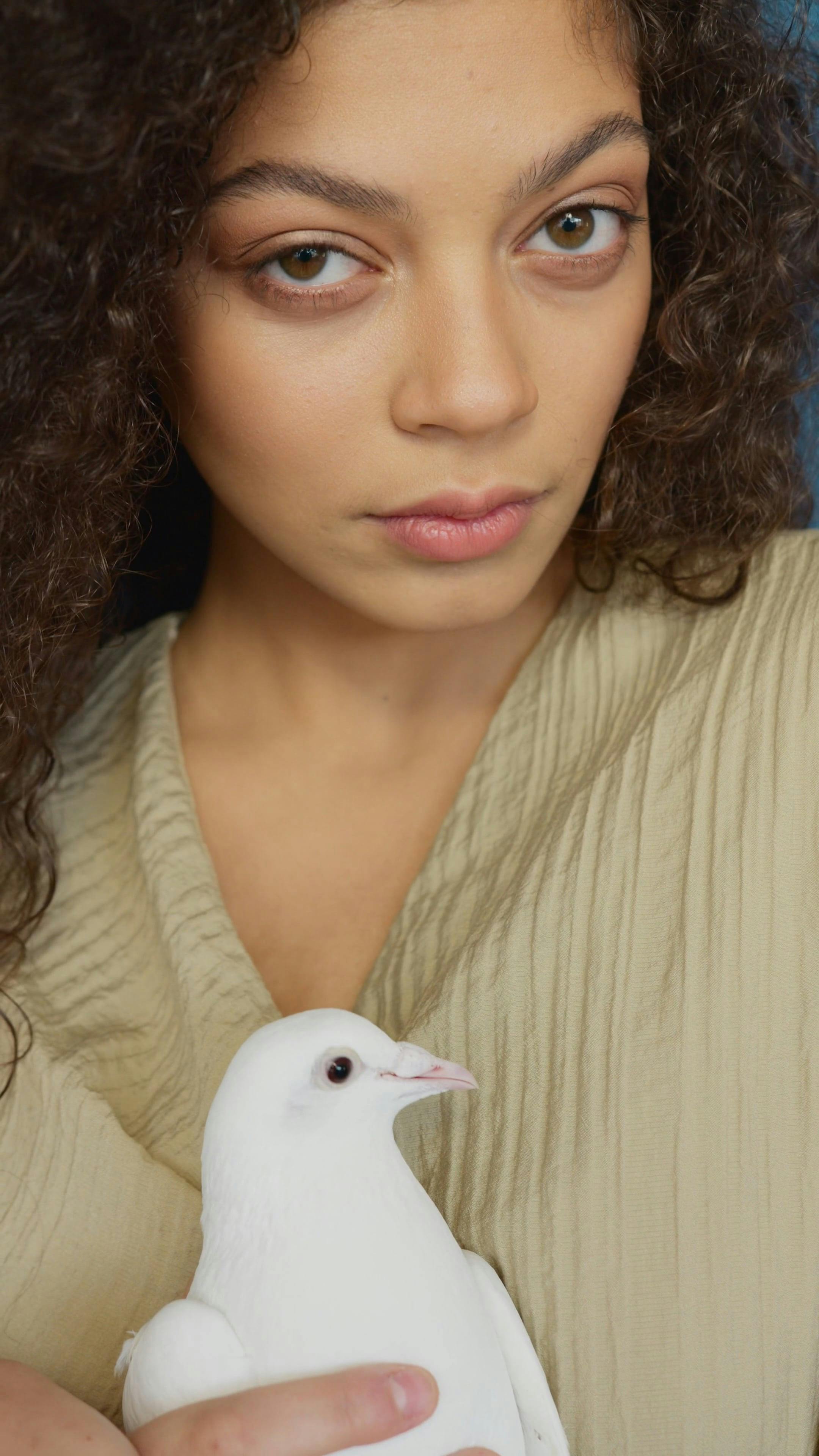 Woman Holding a Dove · Free Stock Video
