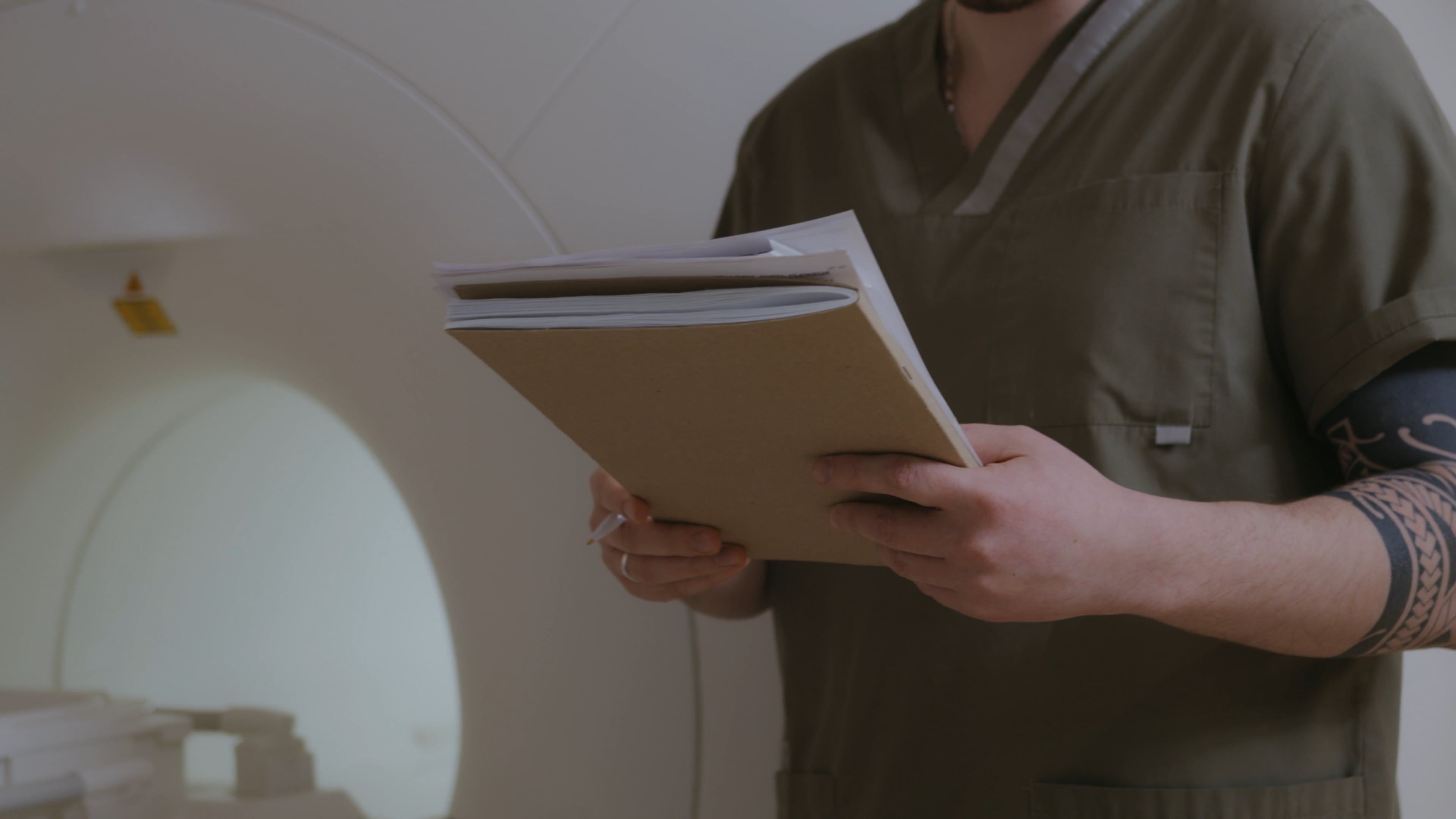 A Sonographer Holding A Patient Medical Chart · Free Stock Video