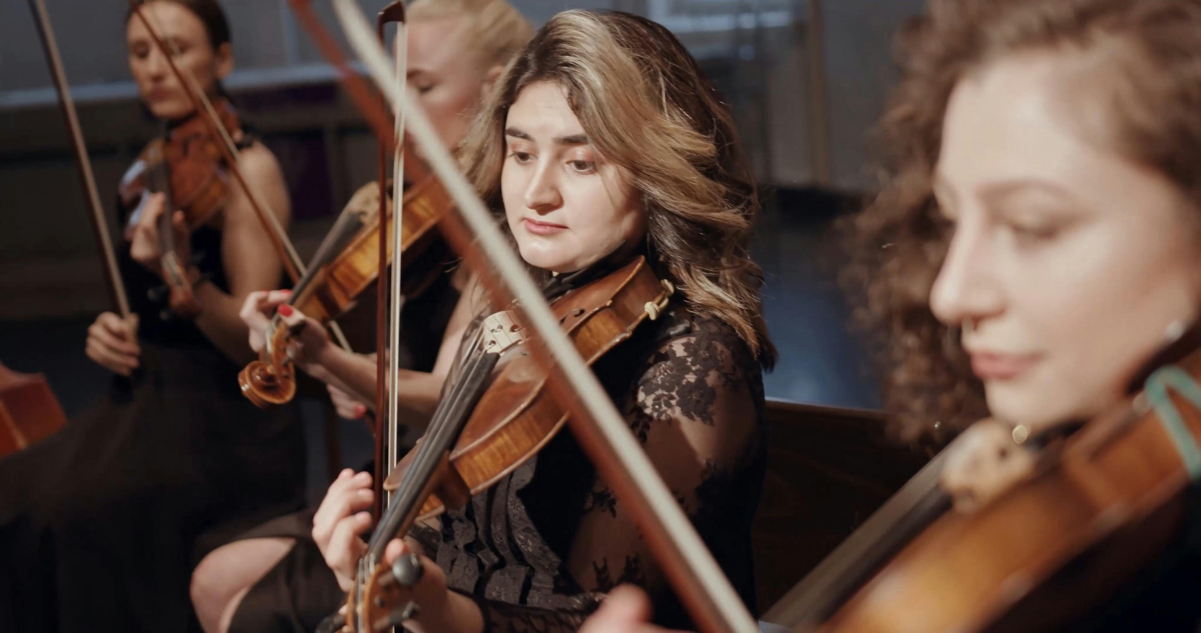 A Group of Women Playing Violin Free Stock Video Footage, Royalty-Free ...