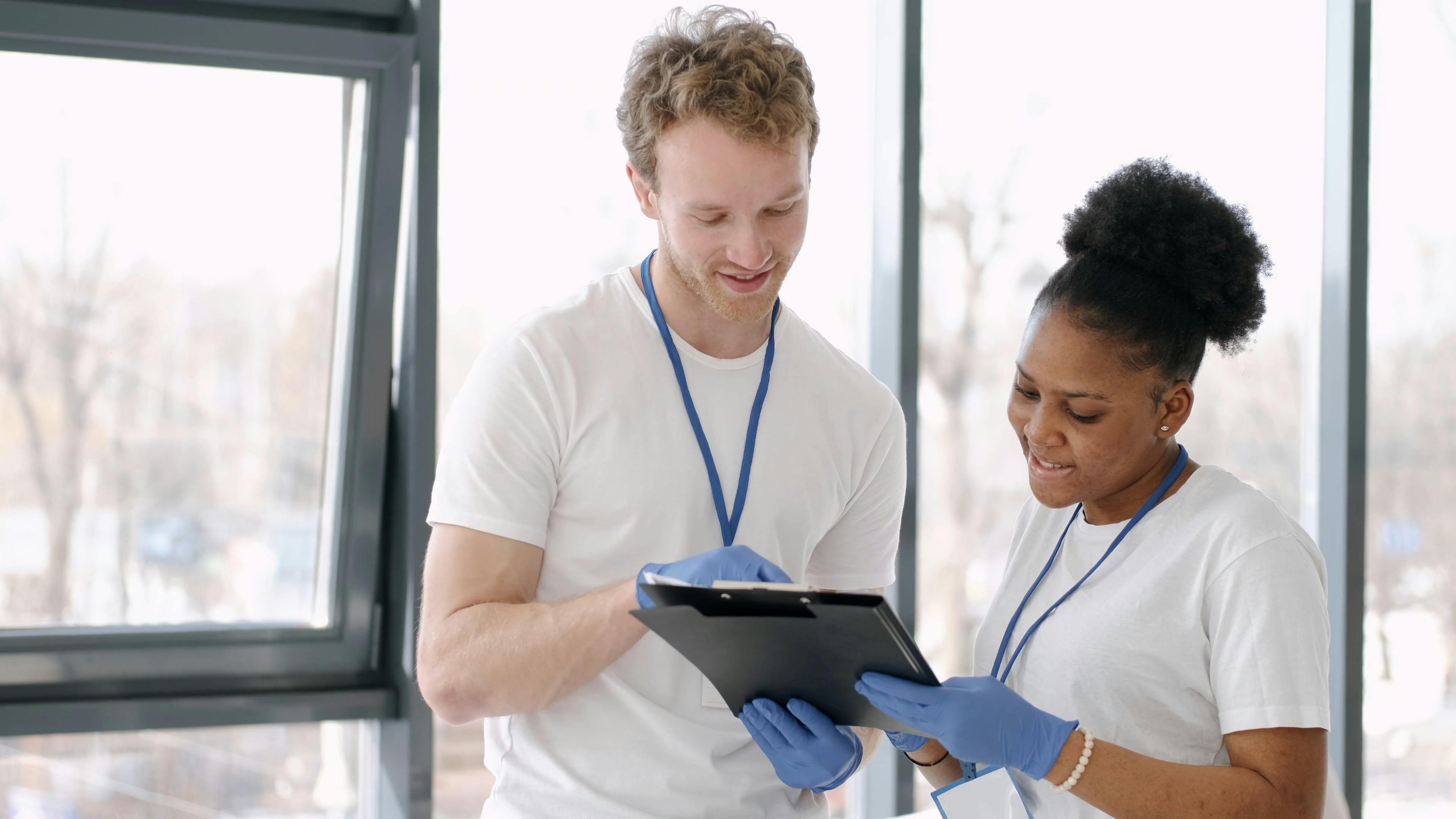 Man And Woman Looking At A List Free Stock Video Footage, Royalty-Free ...