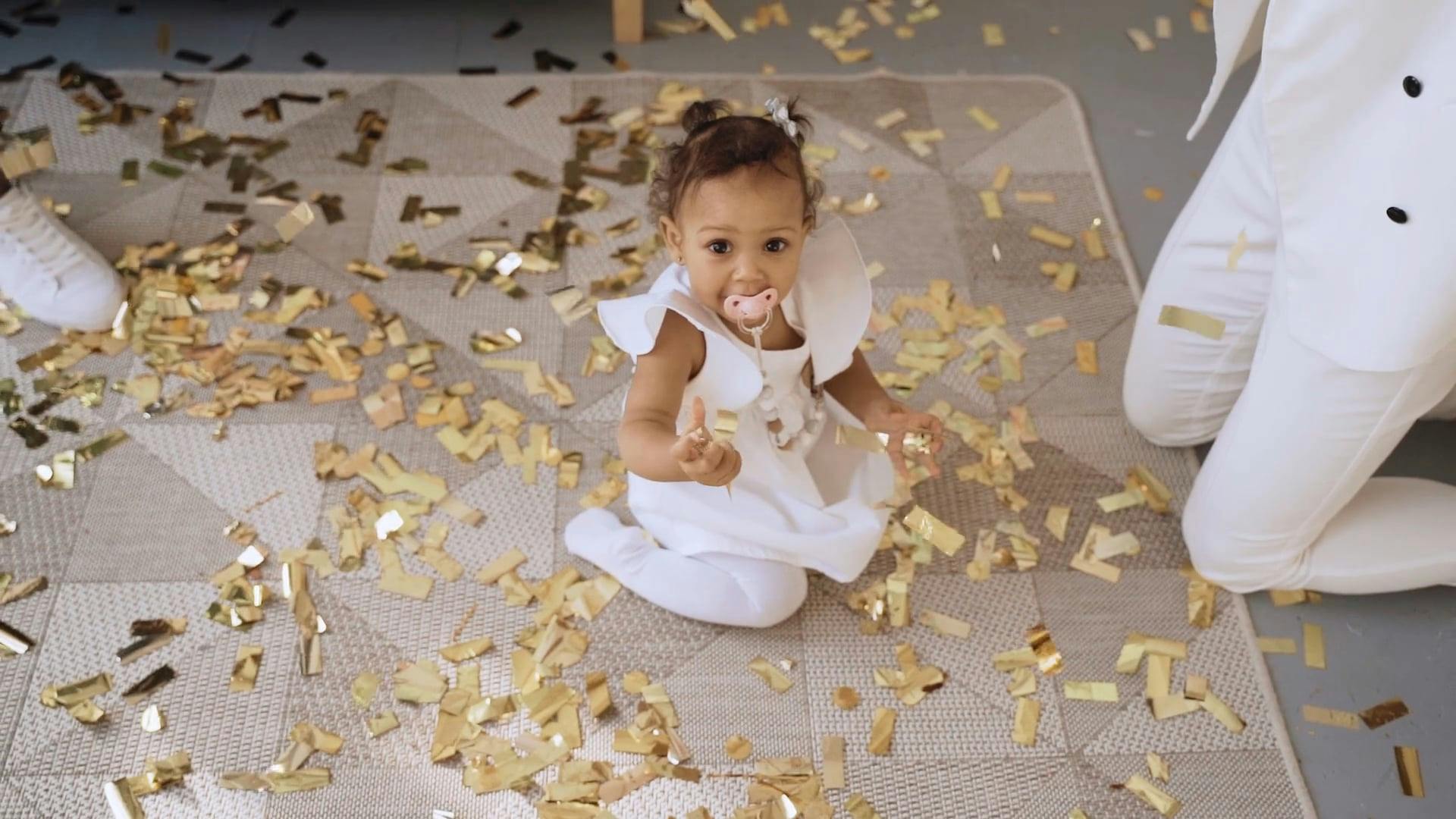 A Cute Girl Showered with Gold Confetti Free Stock Video Footage ...