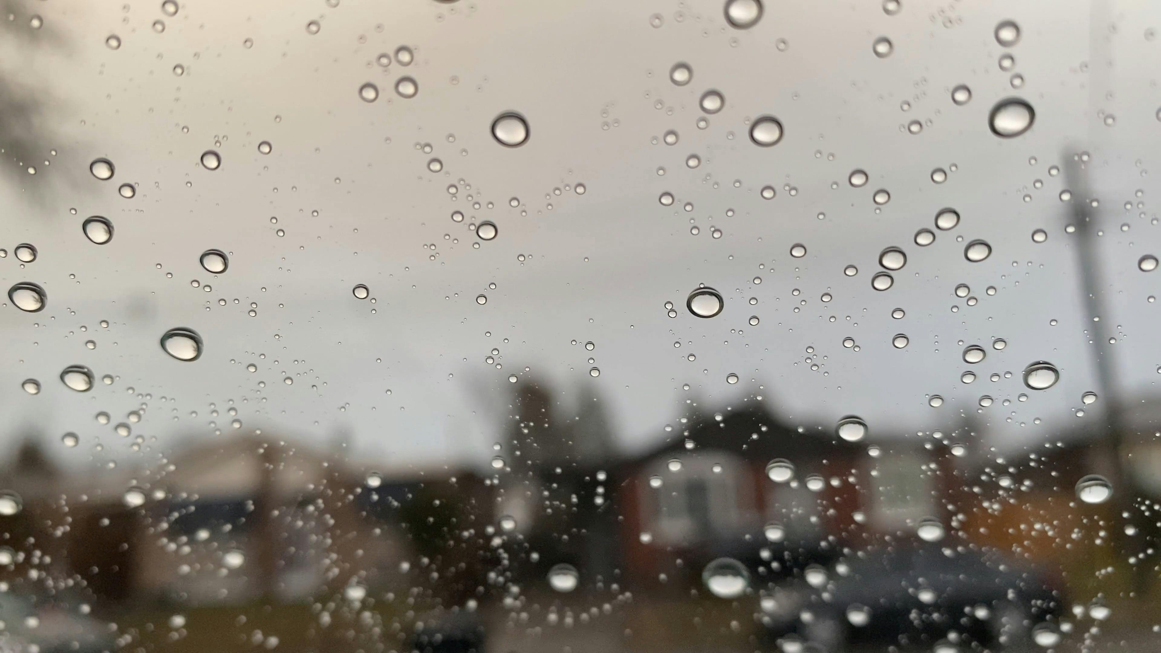 Rain Falling on Glass Window · Free Stock Video